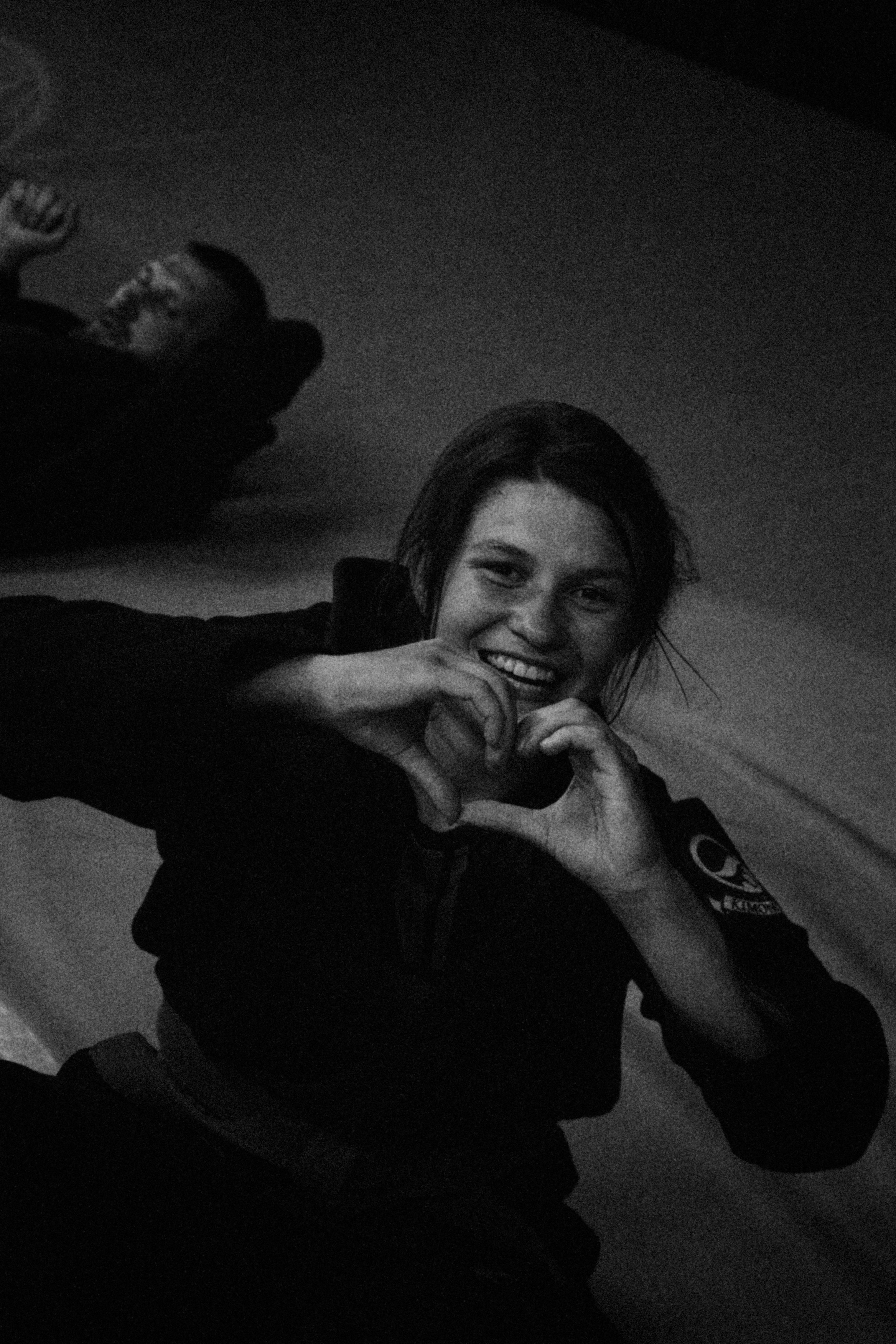 Grins in the Dark: Heartfelt Moment in a Low-Light Studio