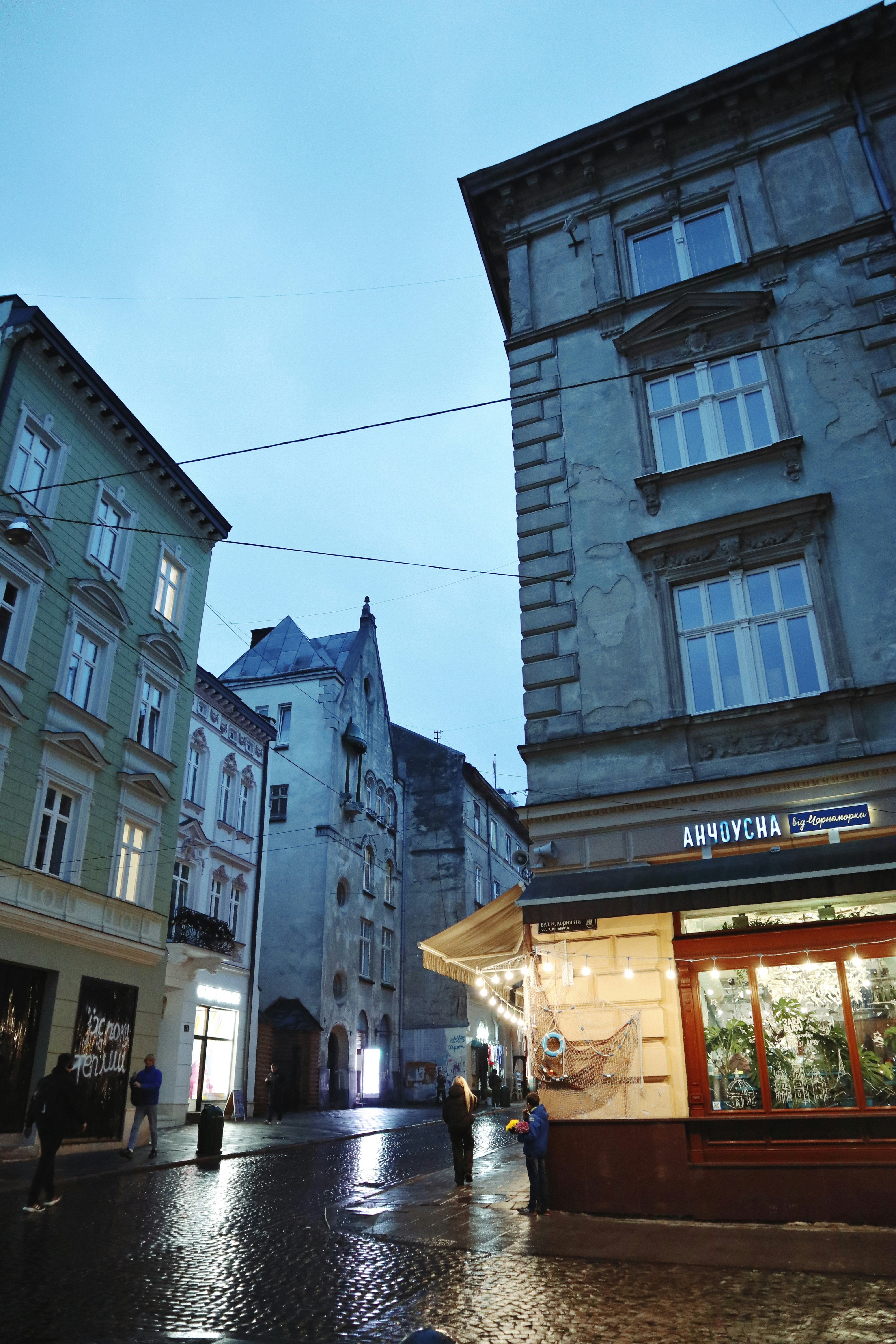 Moonlit Alleyway Café Under Old European Facades