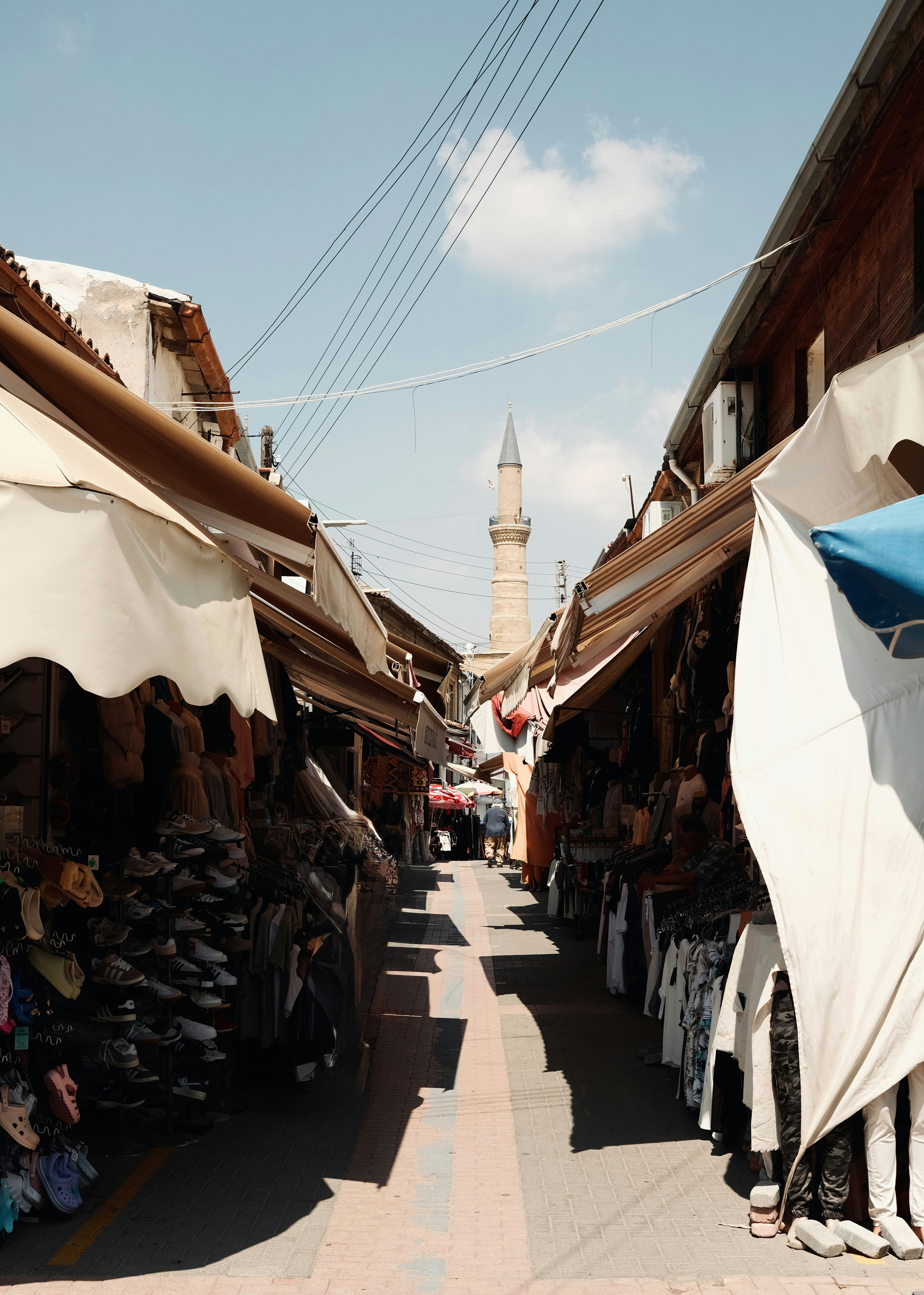 Toward the Minaret: A Bazaar Corridor Framing the City’s Silent Pulse