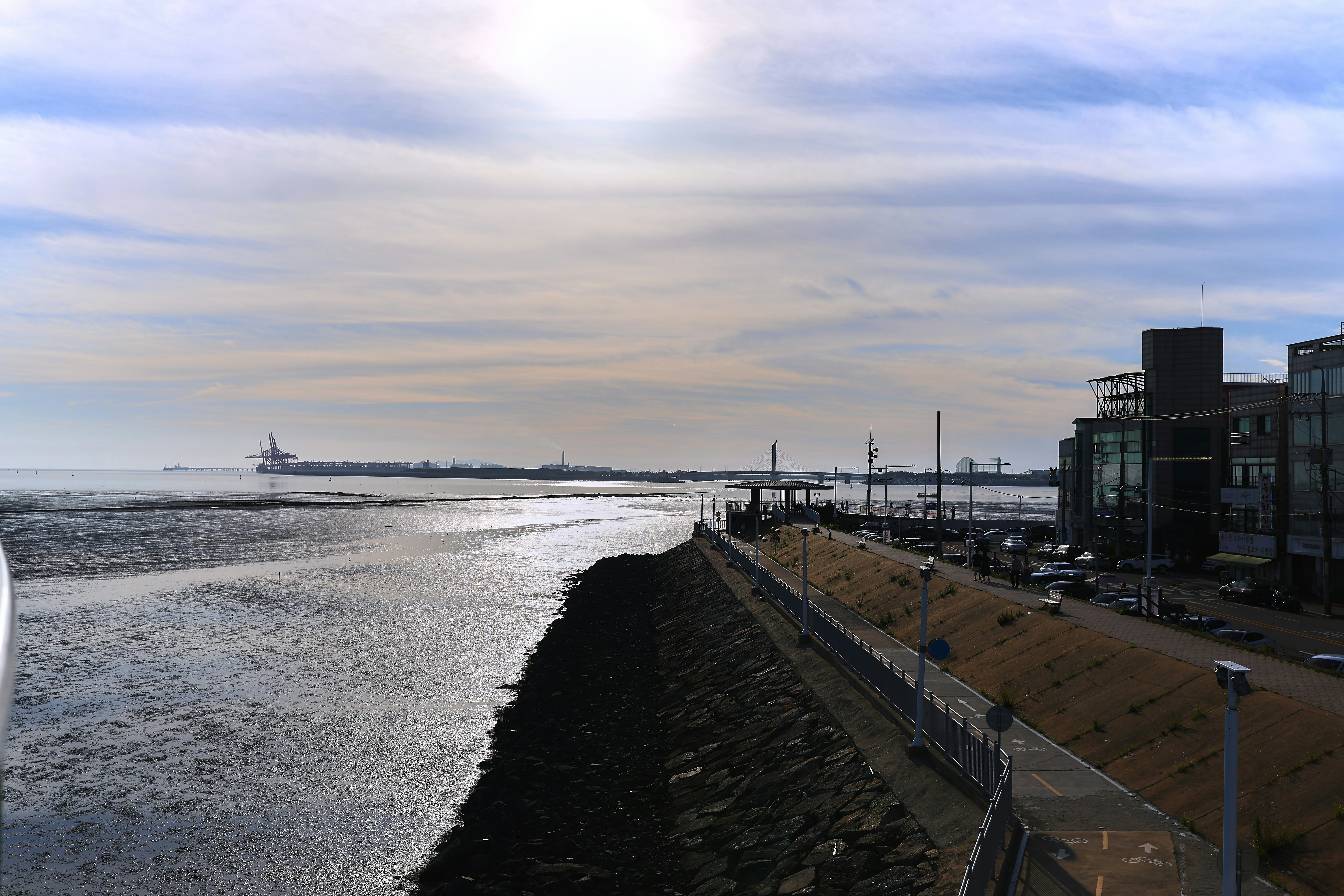 Harbor Promenade at Dusk: Sea Walls and Modern Quays