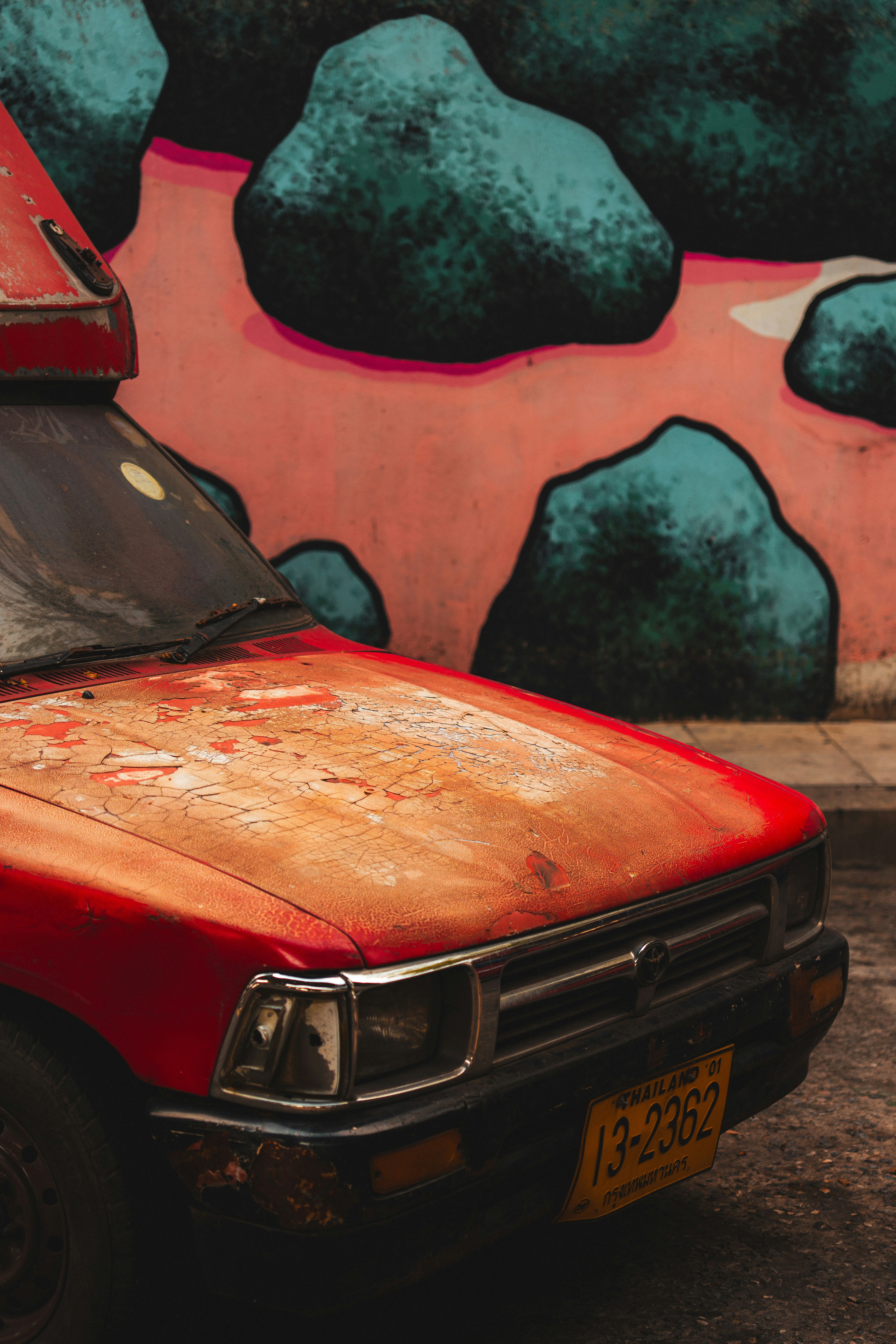 Rusting Red Pickup Meets Street Art Sky