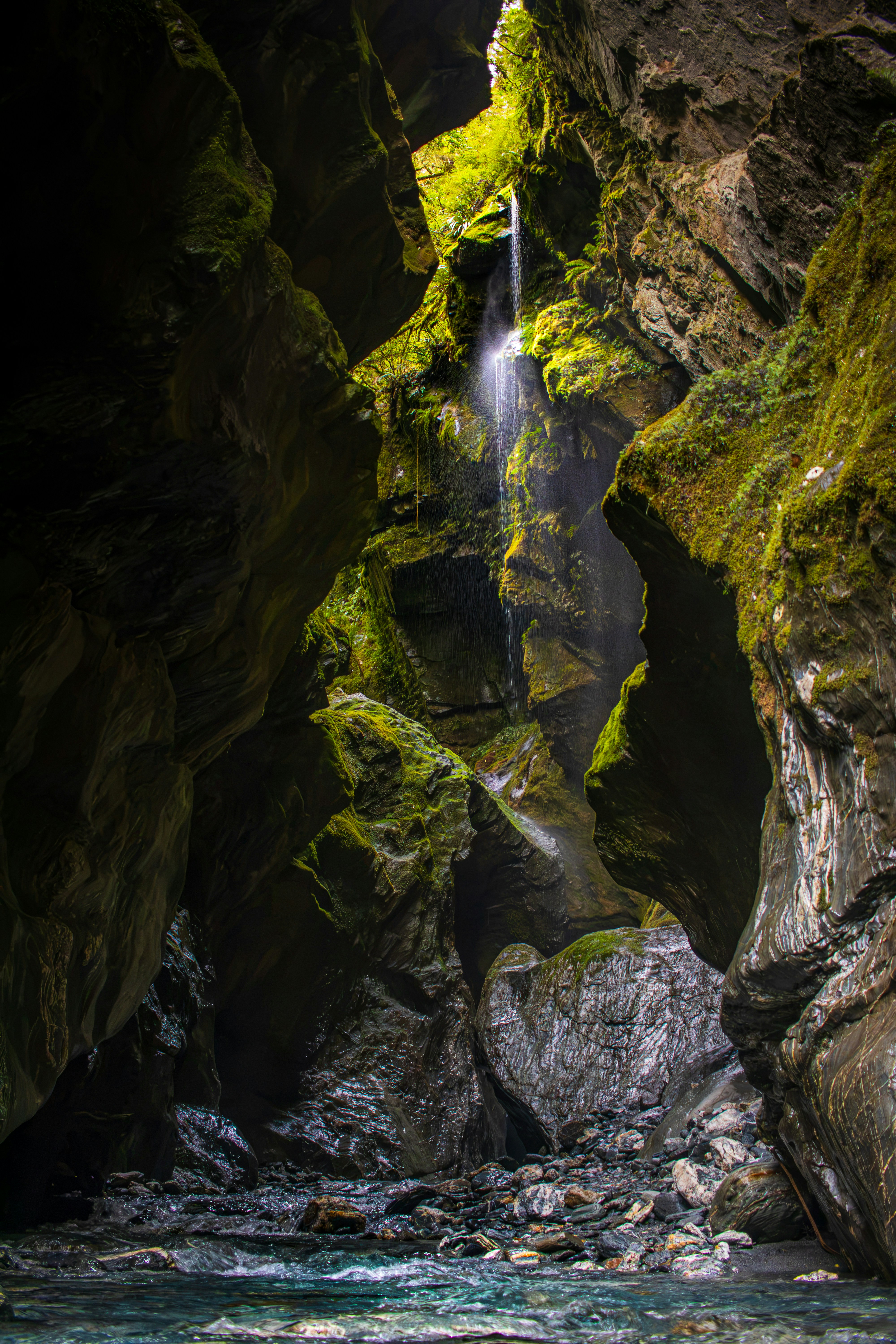 Waterfall Veil in a Moss-Crowned Gorge