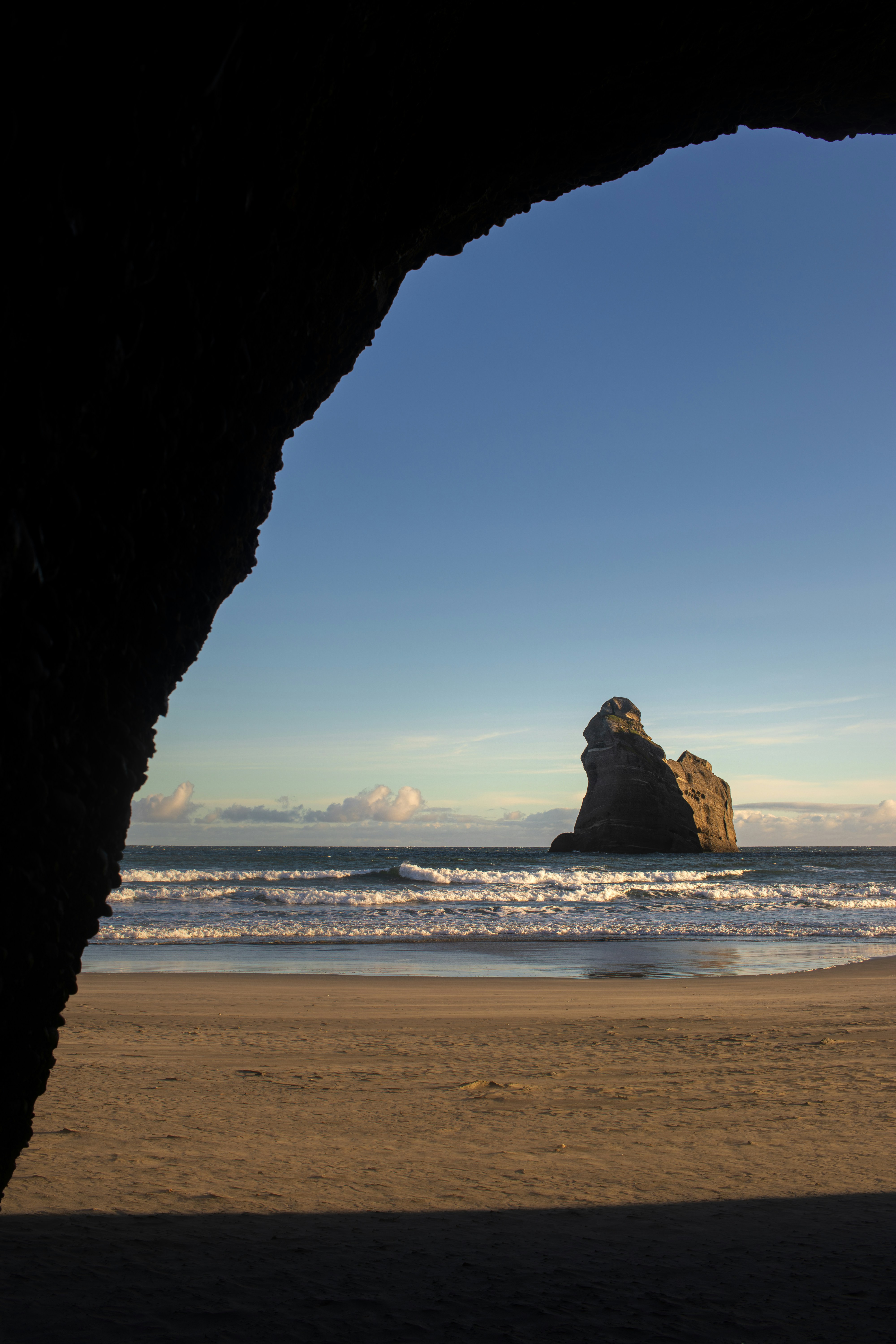 Sea Archway at Dusk: Light Framing a Lone Sea Stack