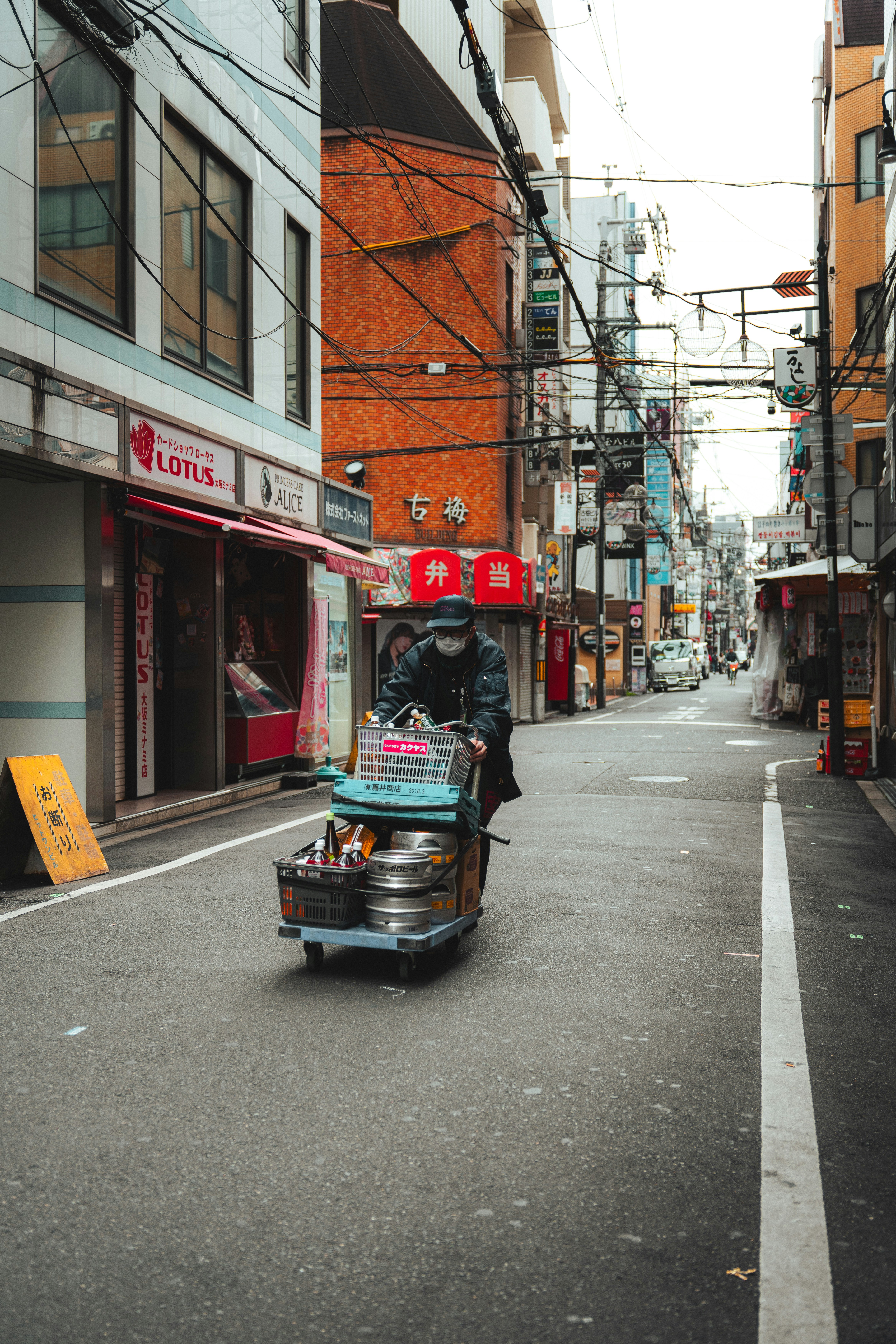 Street Vendor Cart Pushing Through a Quiet City Corridor