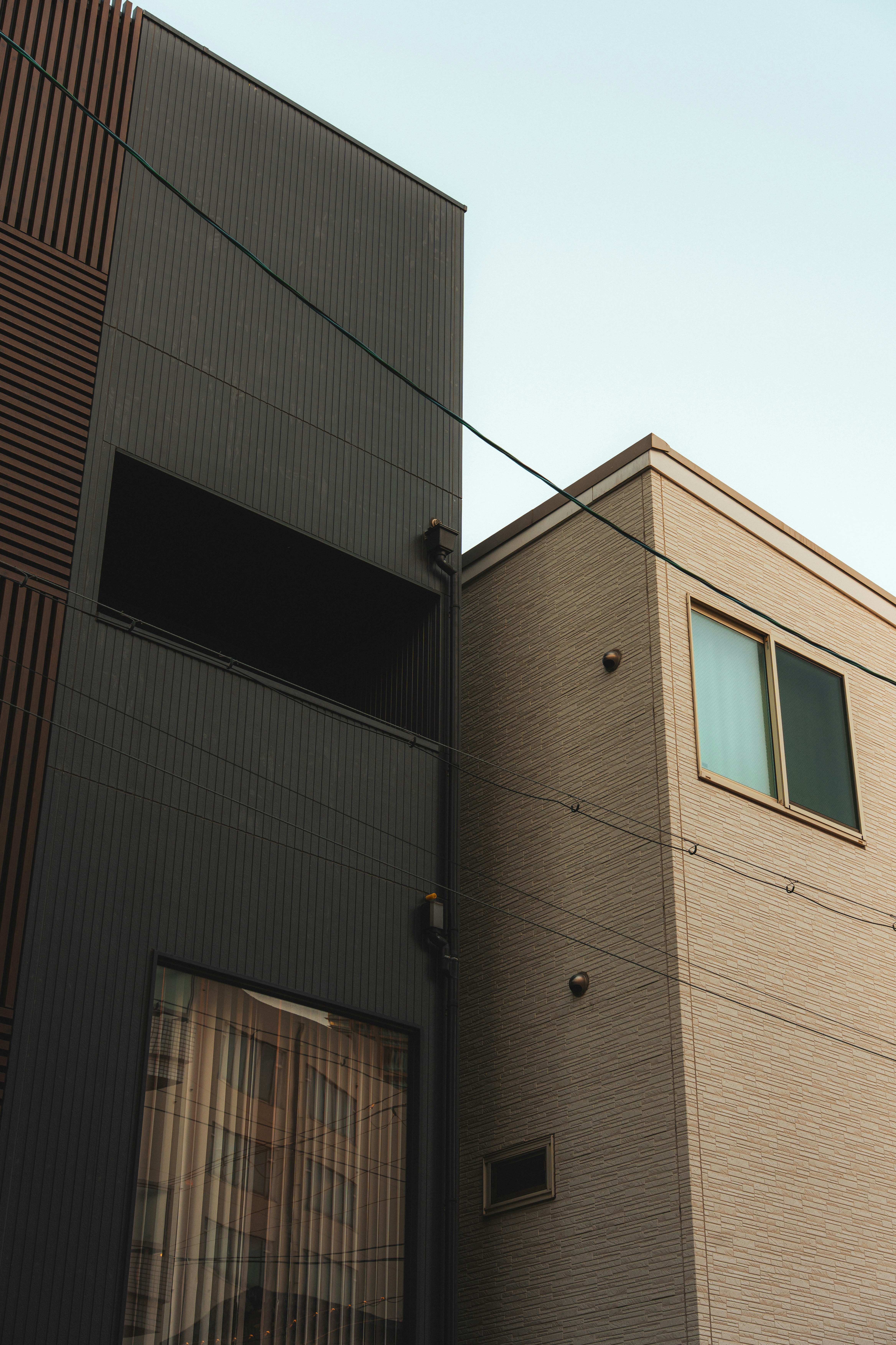 Between Facades: A Quiet Urban Vertical Portrait
