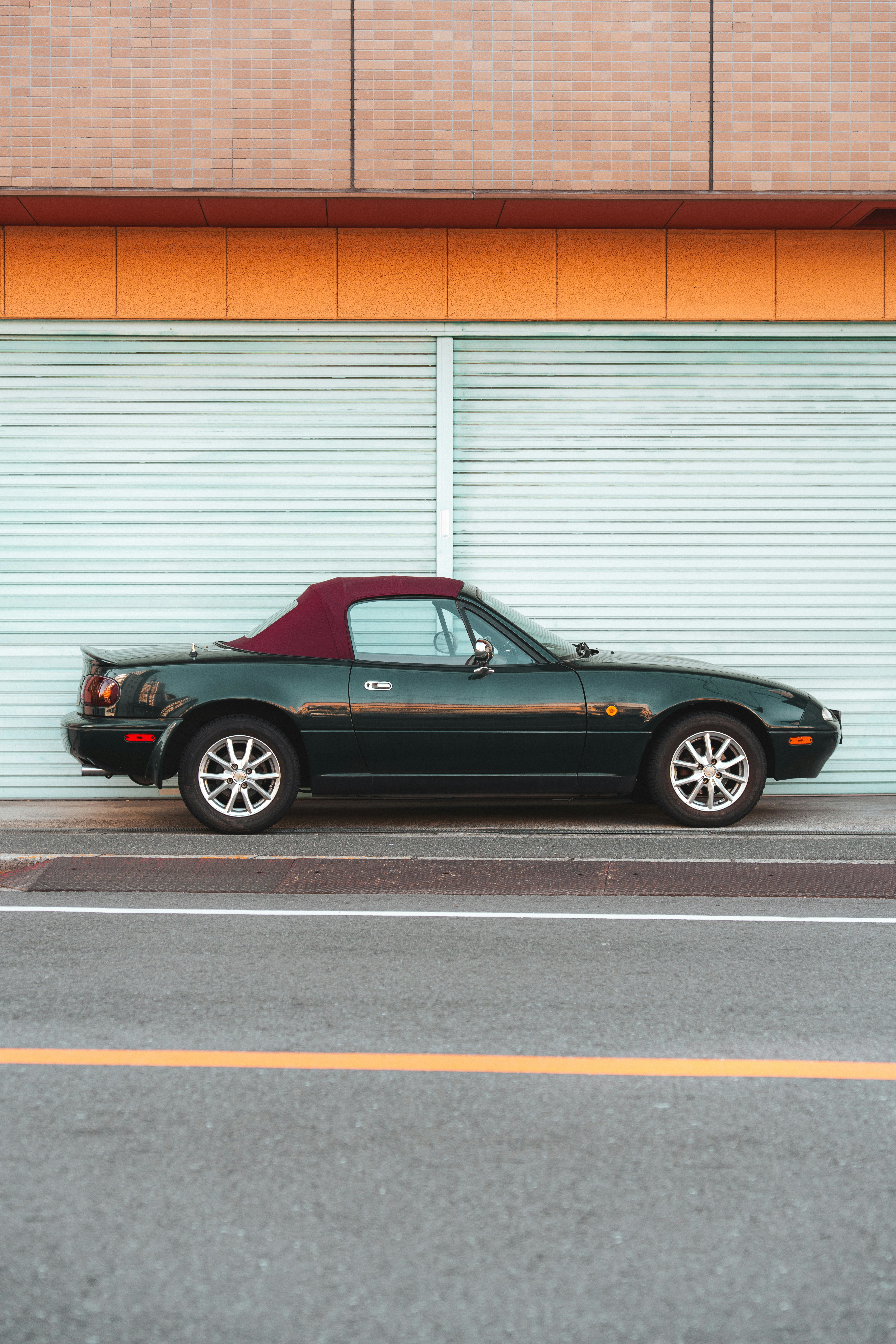 Green Convertible Quietly Anchors a Streetfront