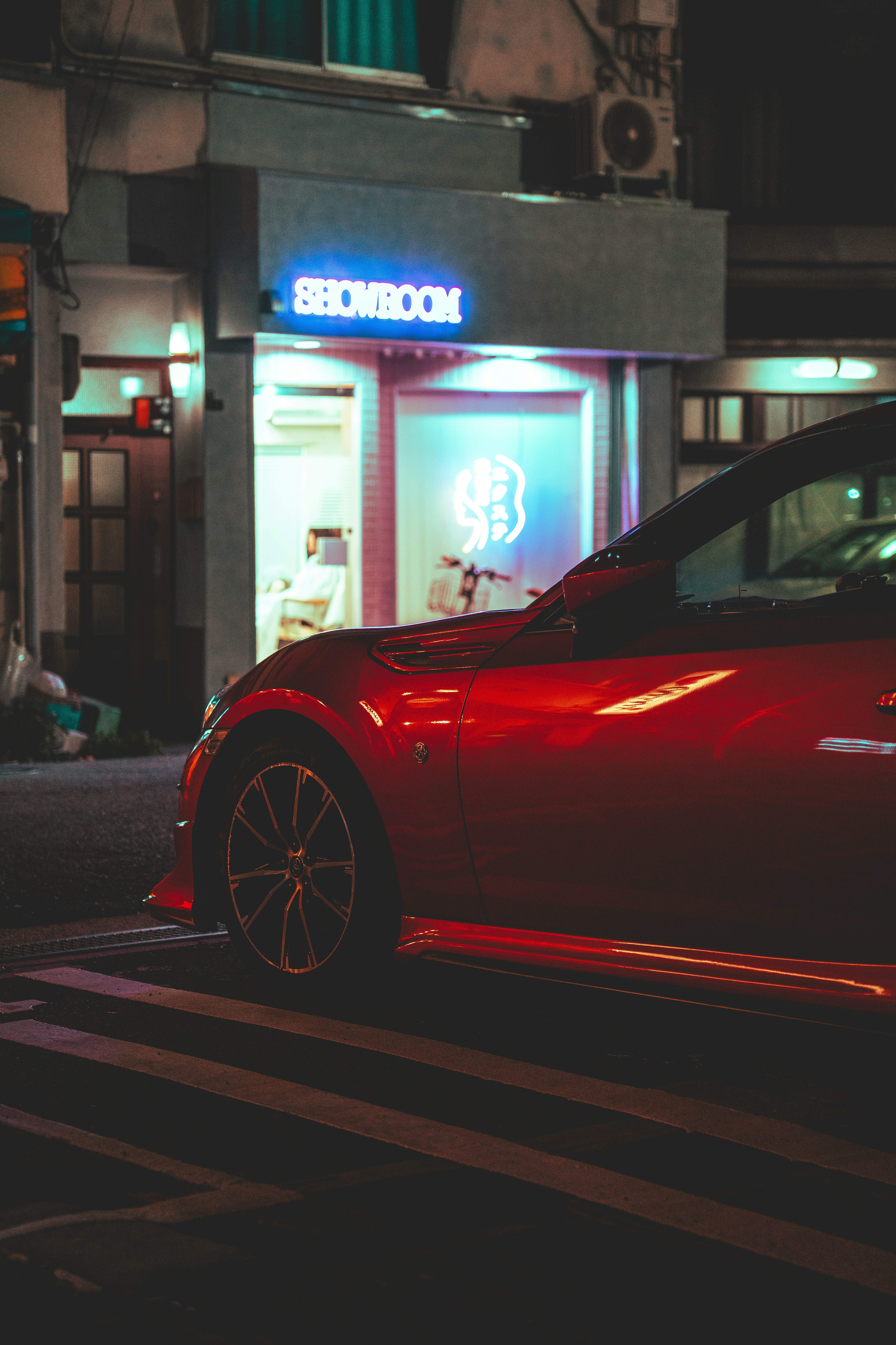 Red Neon Quietude: A Street-Side Car Rest in Neon Night