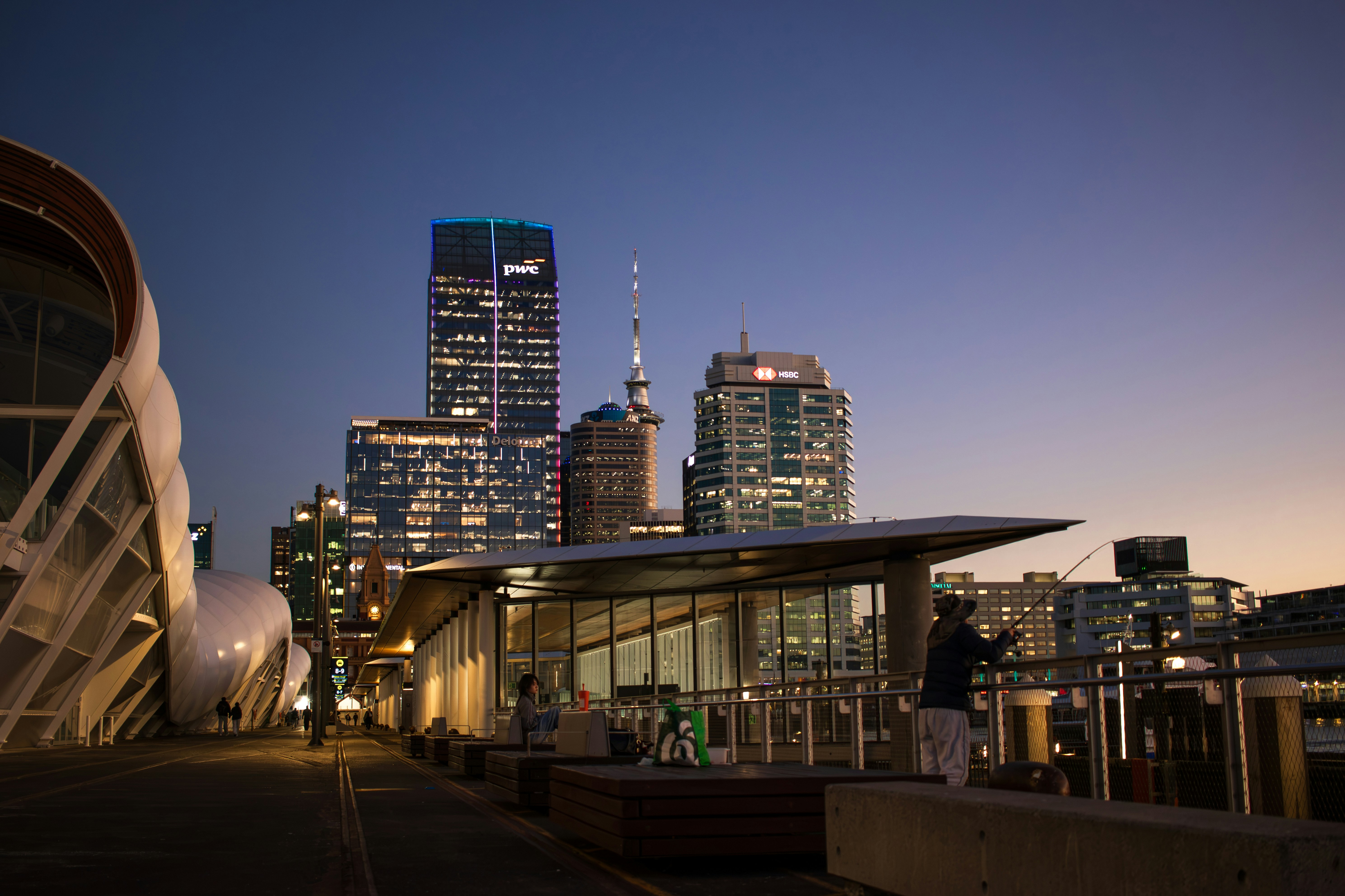Evening Waterfront Overlook: City Lights and Modern Pier