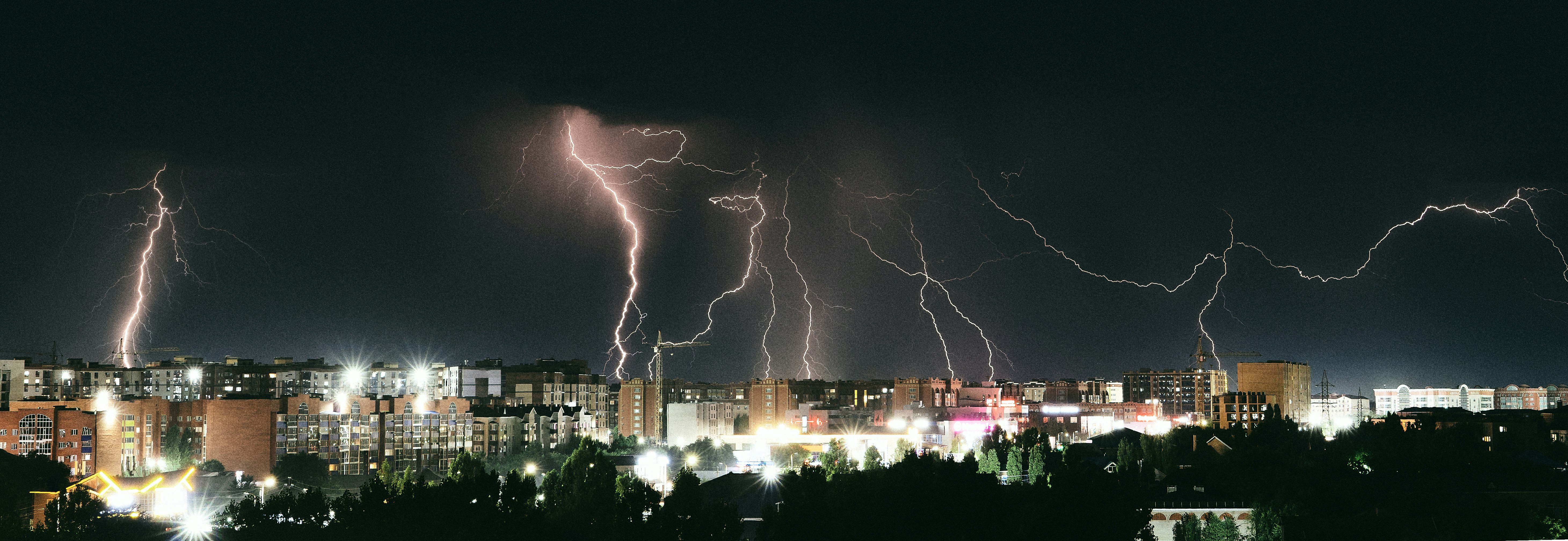 Urban Lightning Ballet Over a City Horizon