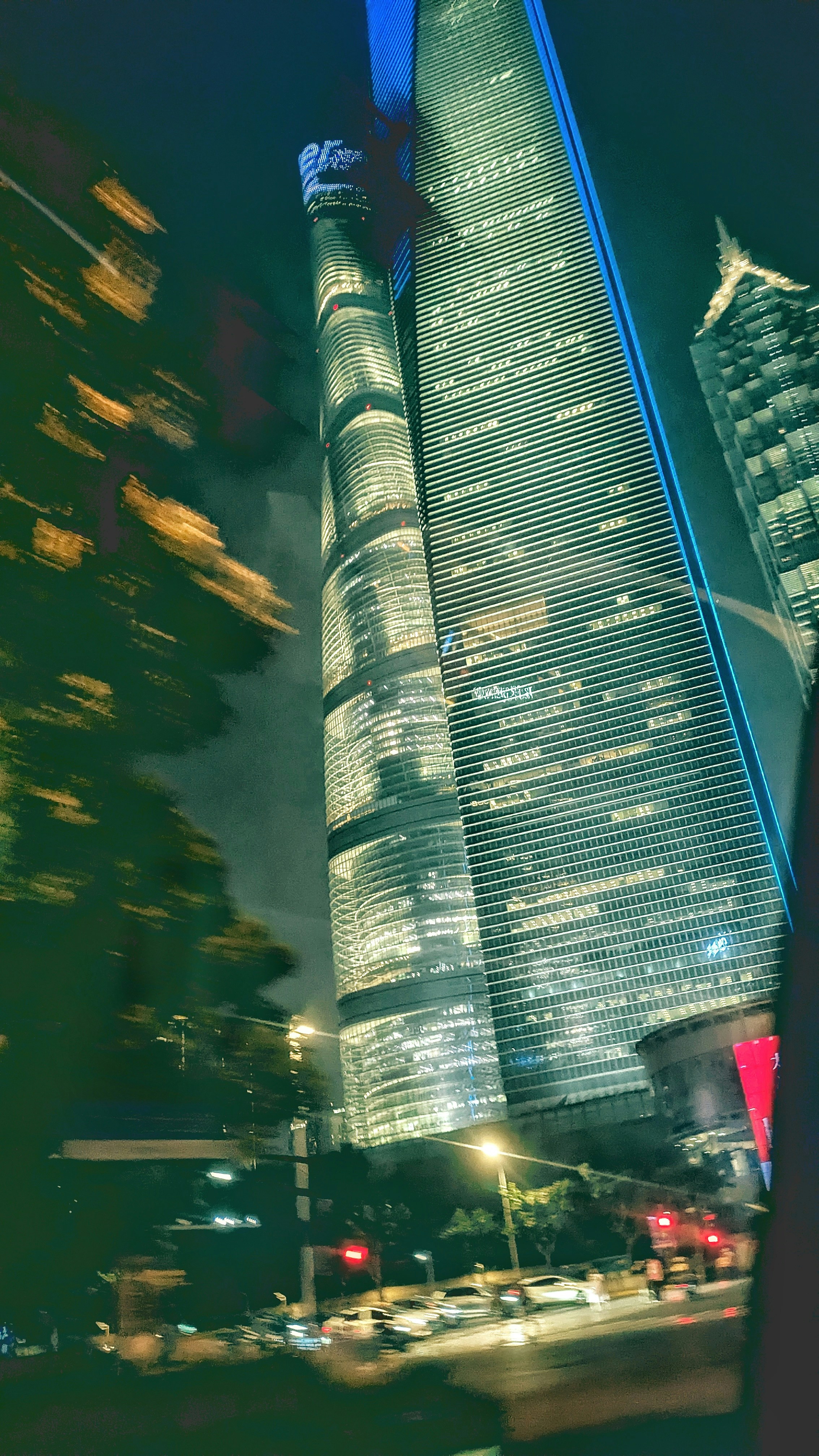 Skyline Sentinel: The Night Pulse of a Towering Glass Giant
