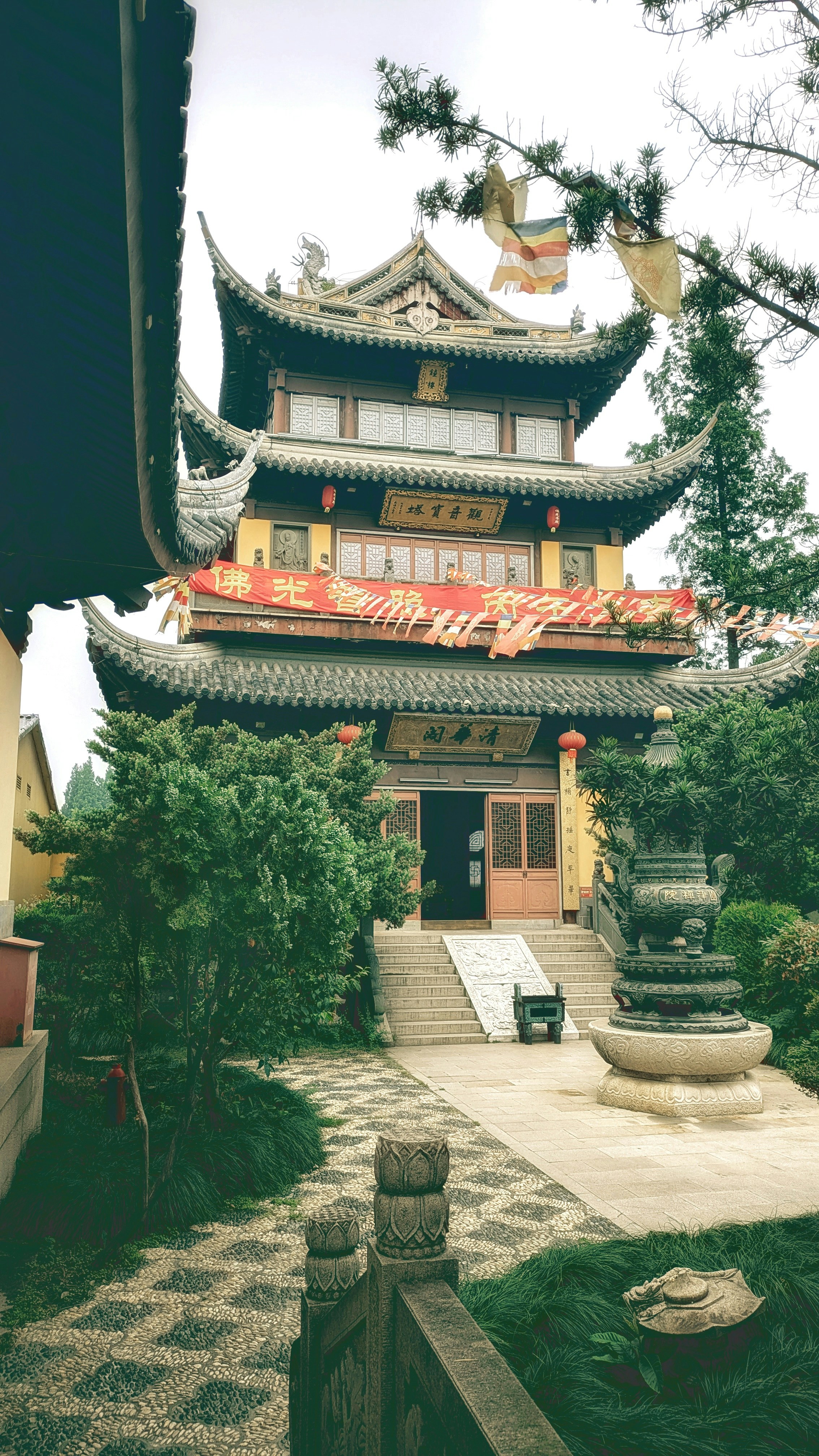 Temple Tier: A multi-roof pavilion rising above tranquil garden