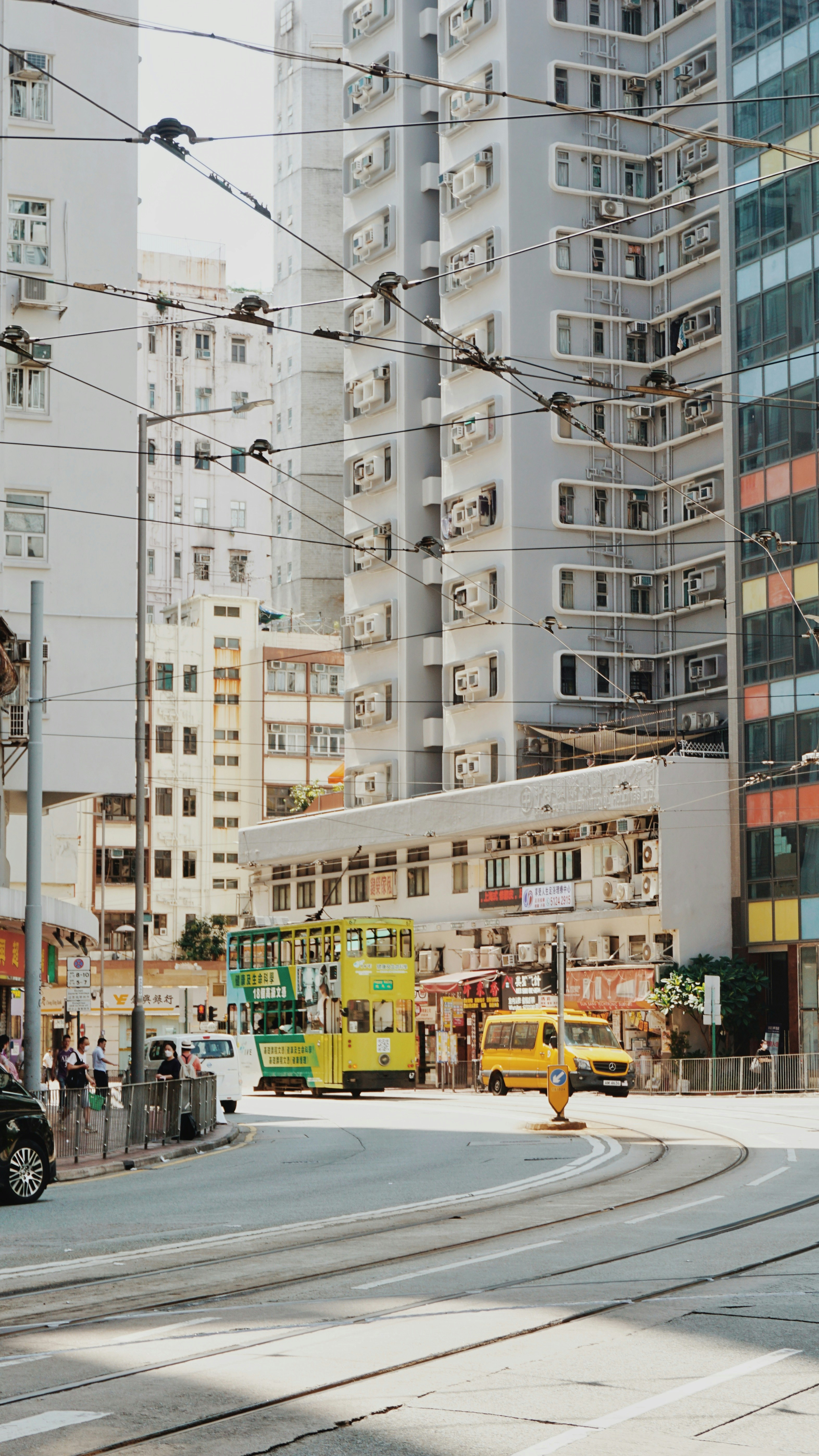 City Tramlines Under Wires: A Quiet Morning Between Skyscrapers