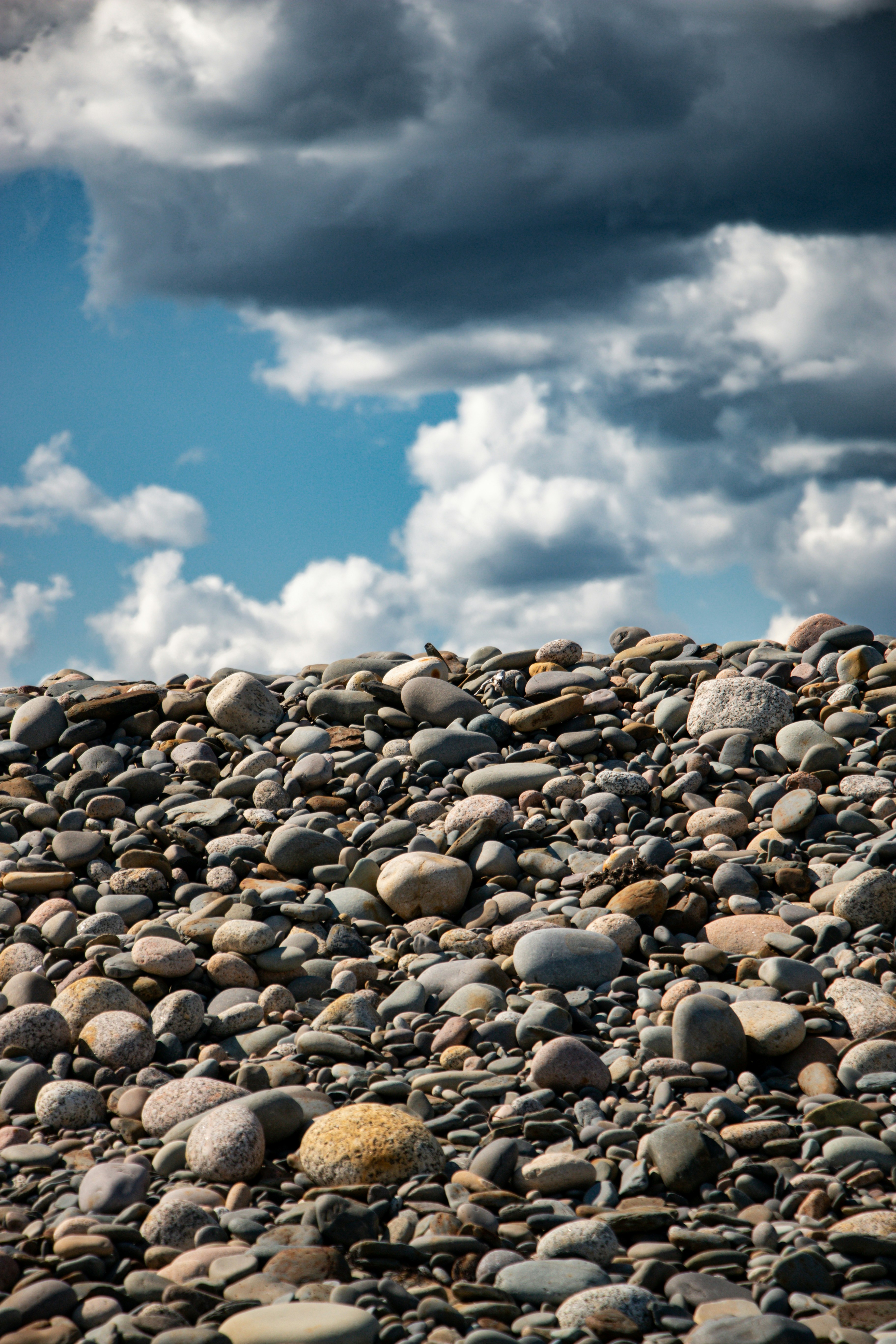 Stone Beacons Beneath a Sky of Rolling Clouds
