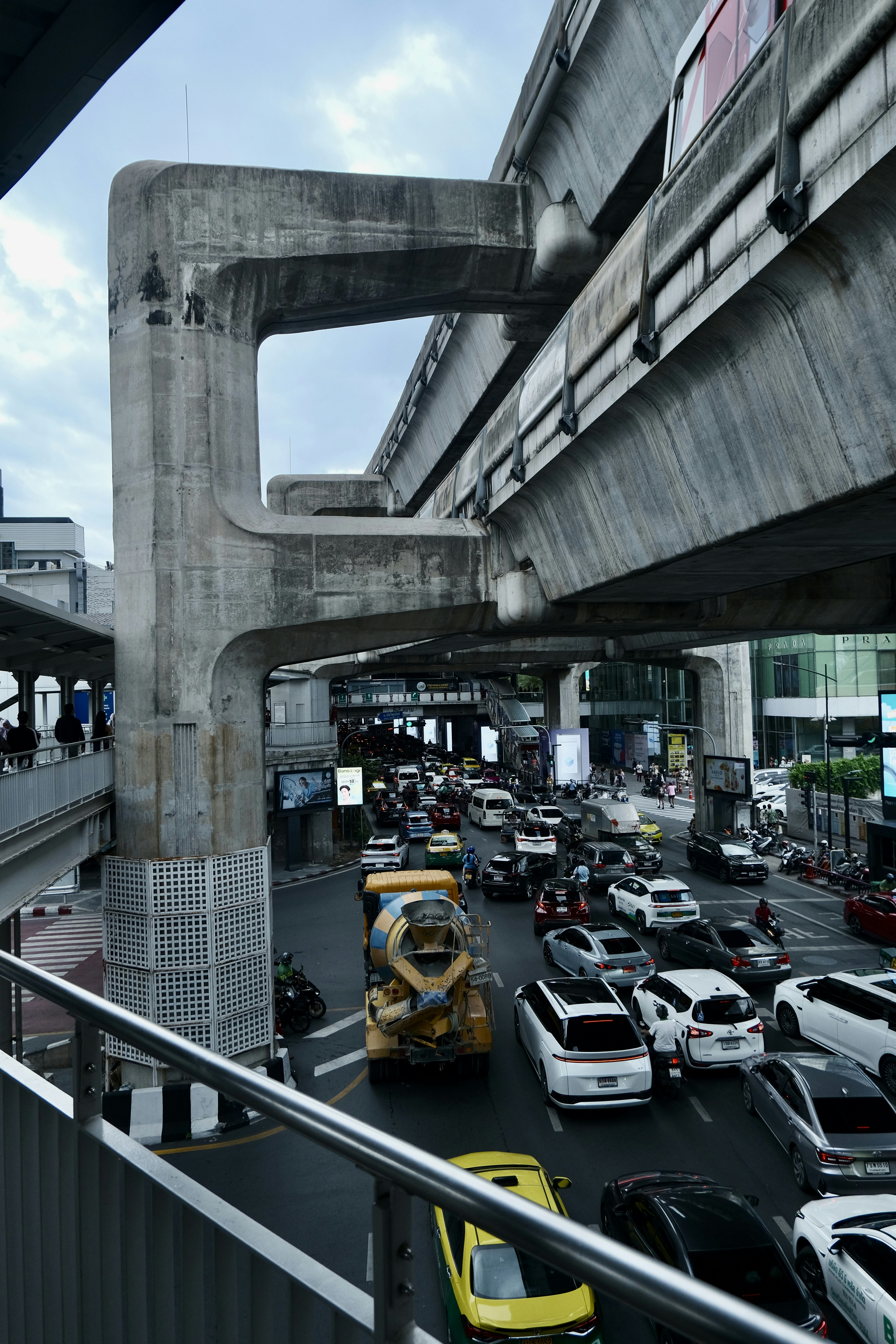 Urban Skyways: Concrete Overpasses Loom Over a River of Traffic