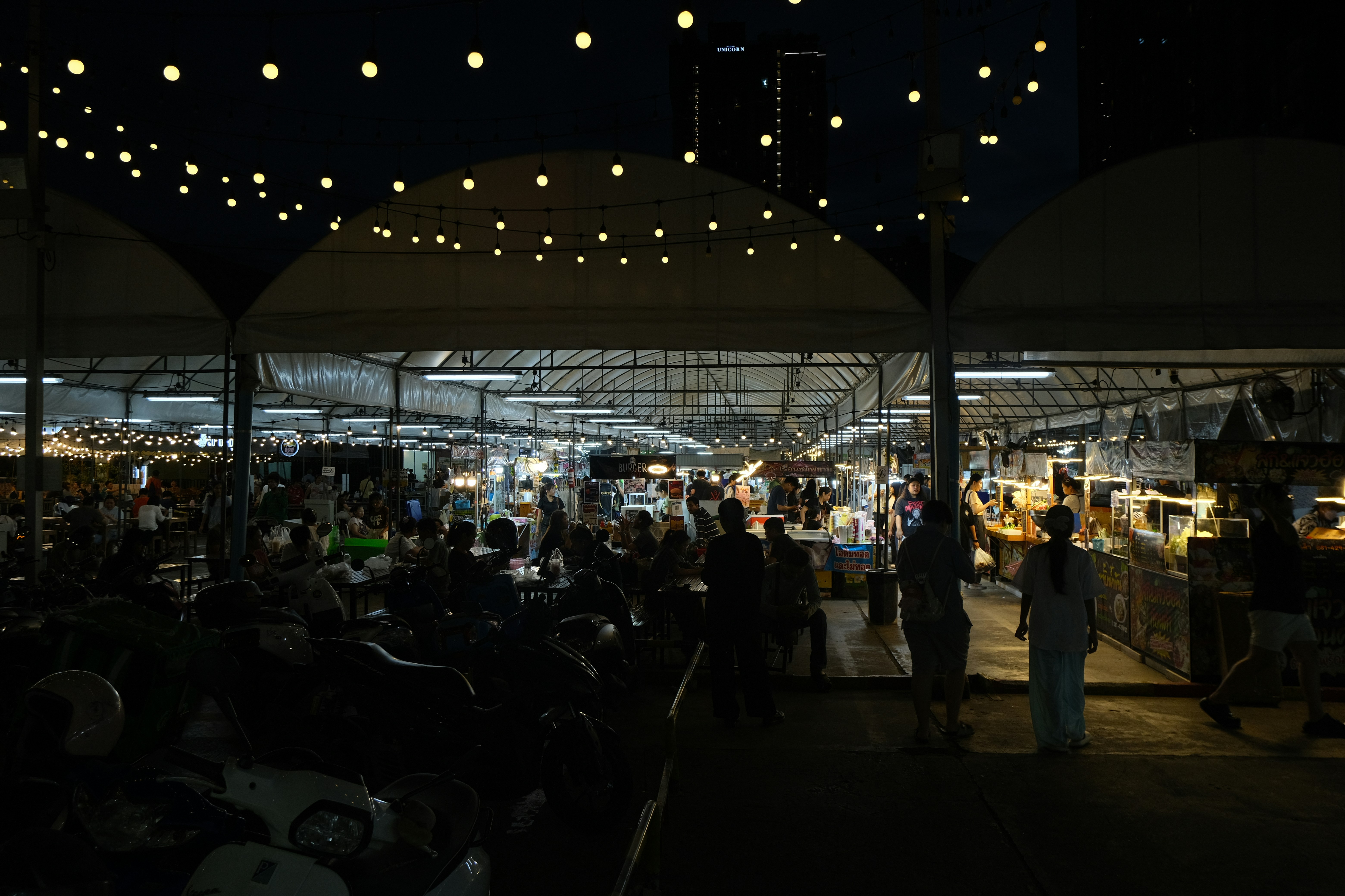 Night Market Glow: Ad Hoc Lights and People in a Dimly Lit Bazaar