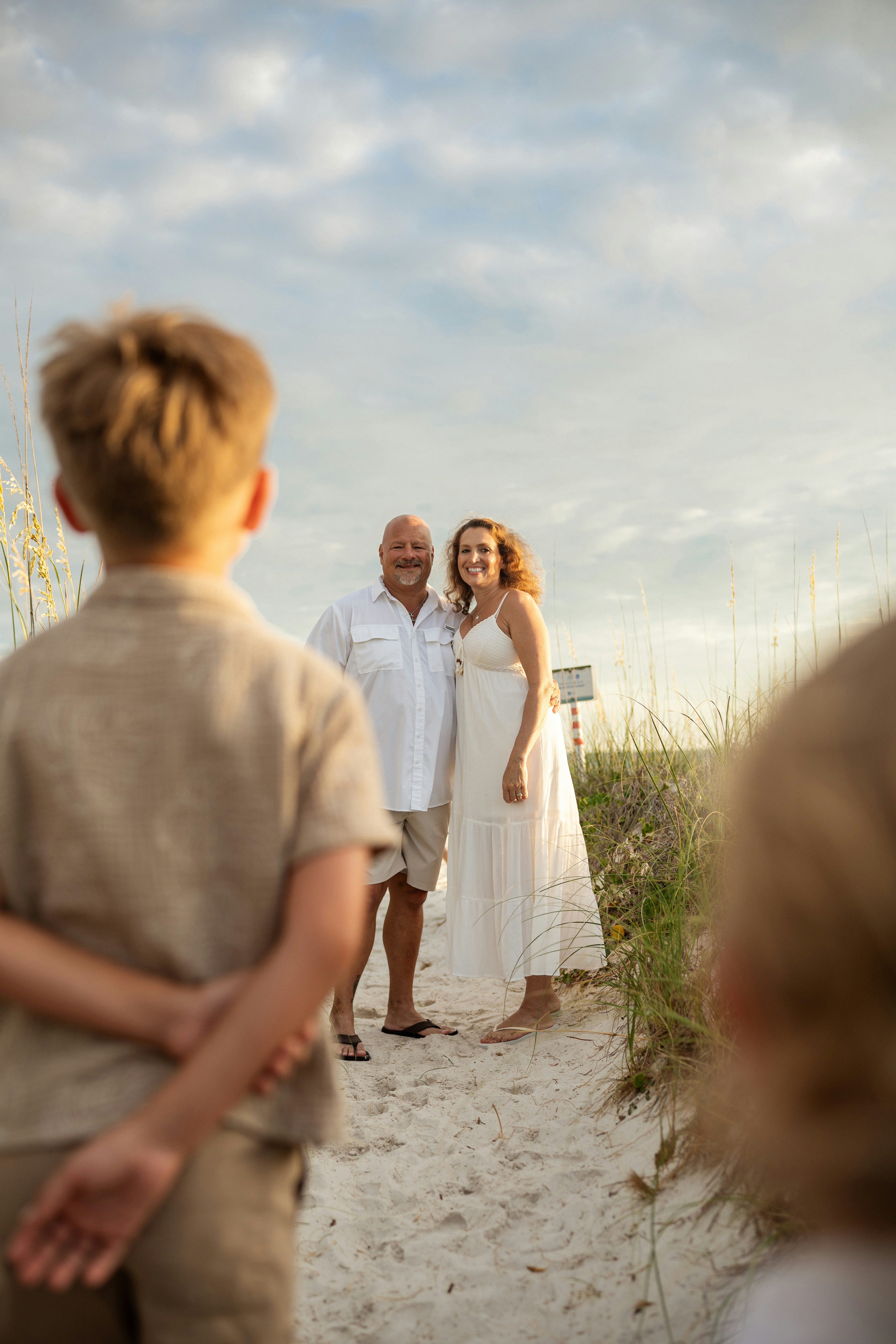 Family Portrait on the Dunes: A Gentle Moment by the Sea