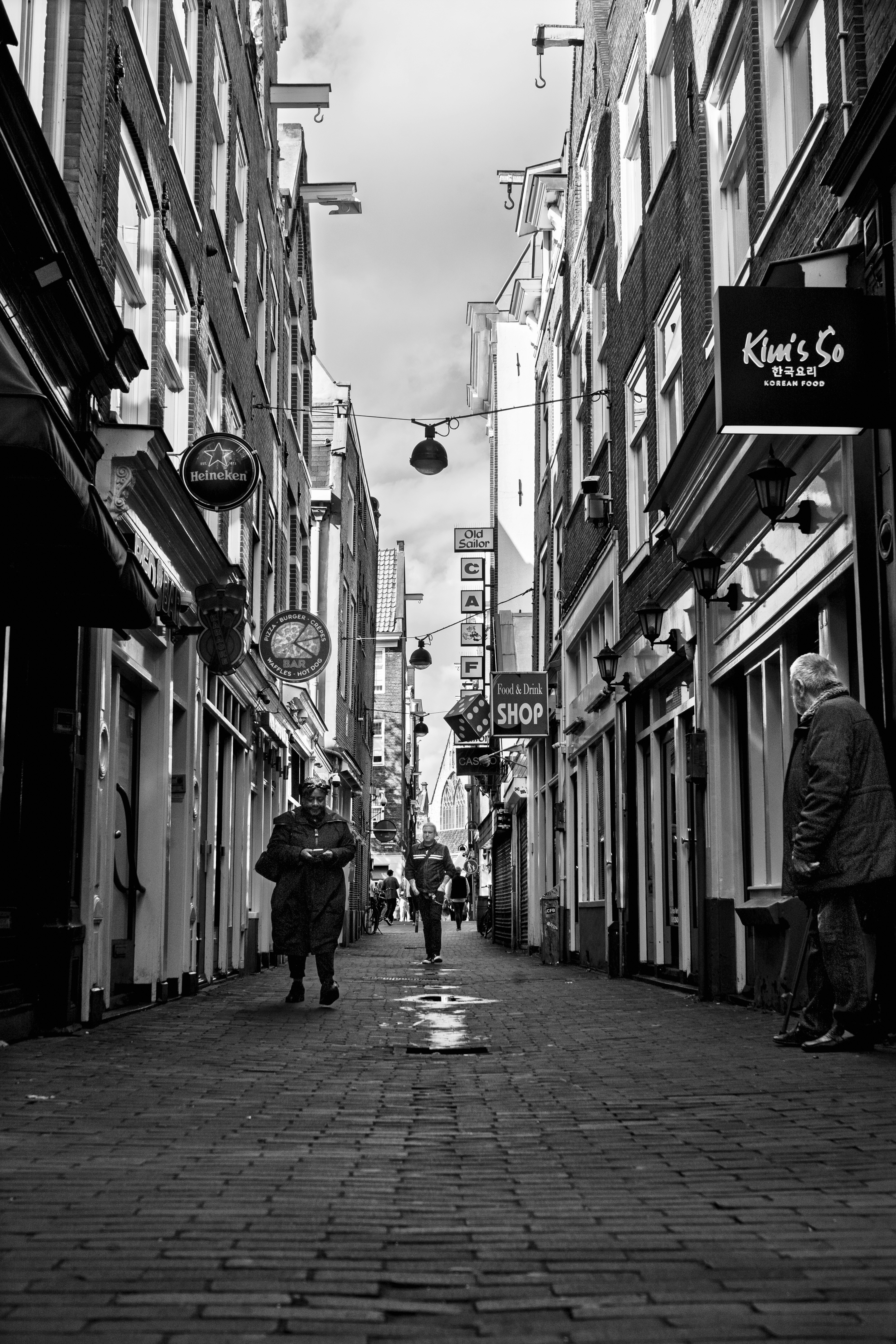 Cobblestone Corridor: A Quiet Moment Between Shopfronts