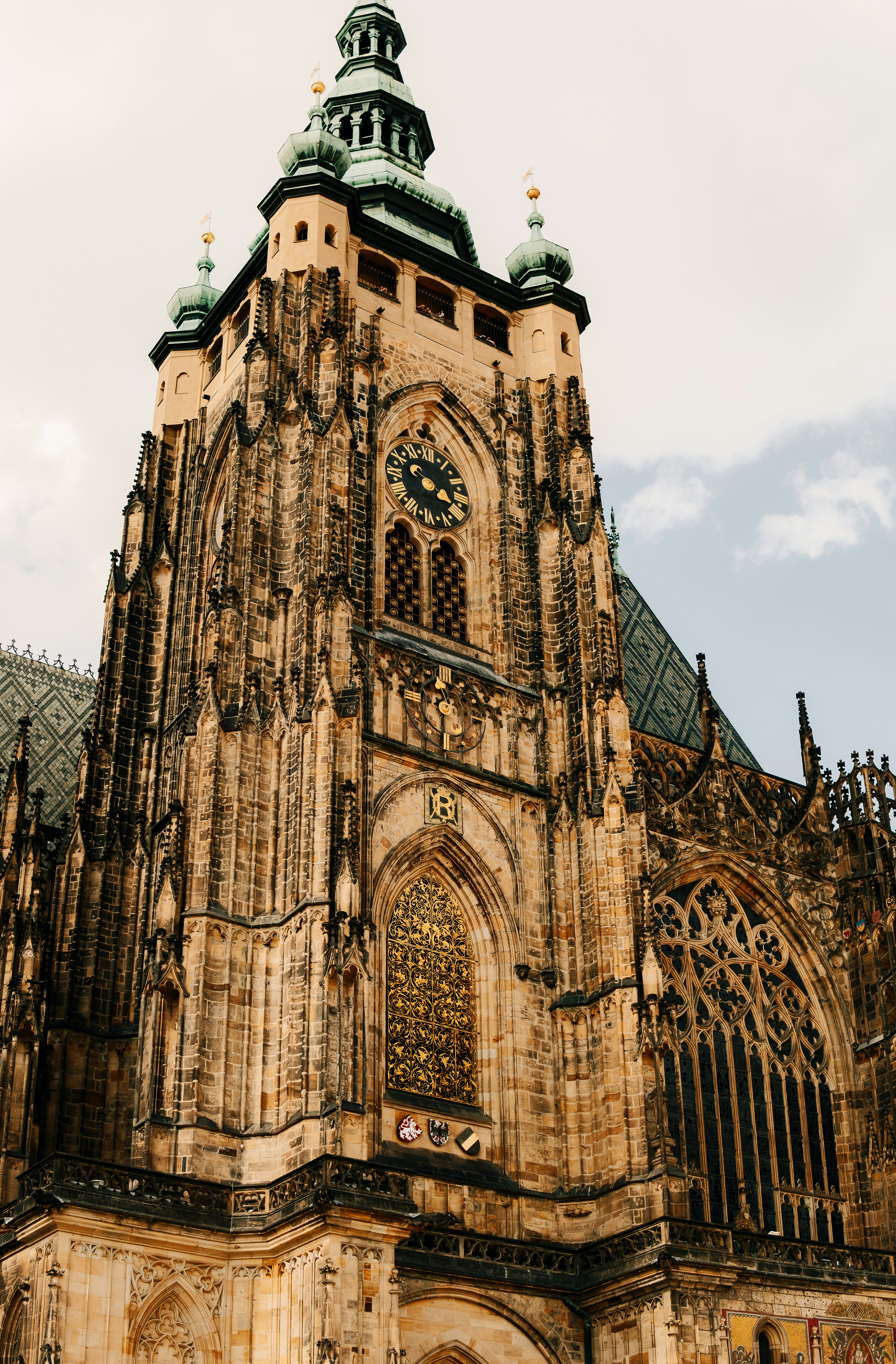 Gothic Clocktower Ascending: A Cathedral Facade in Warm Light