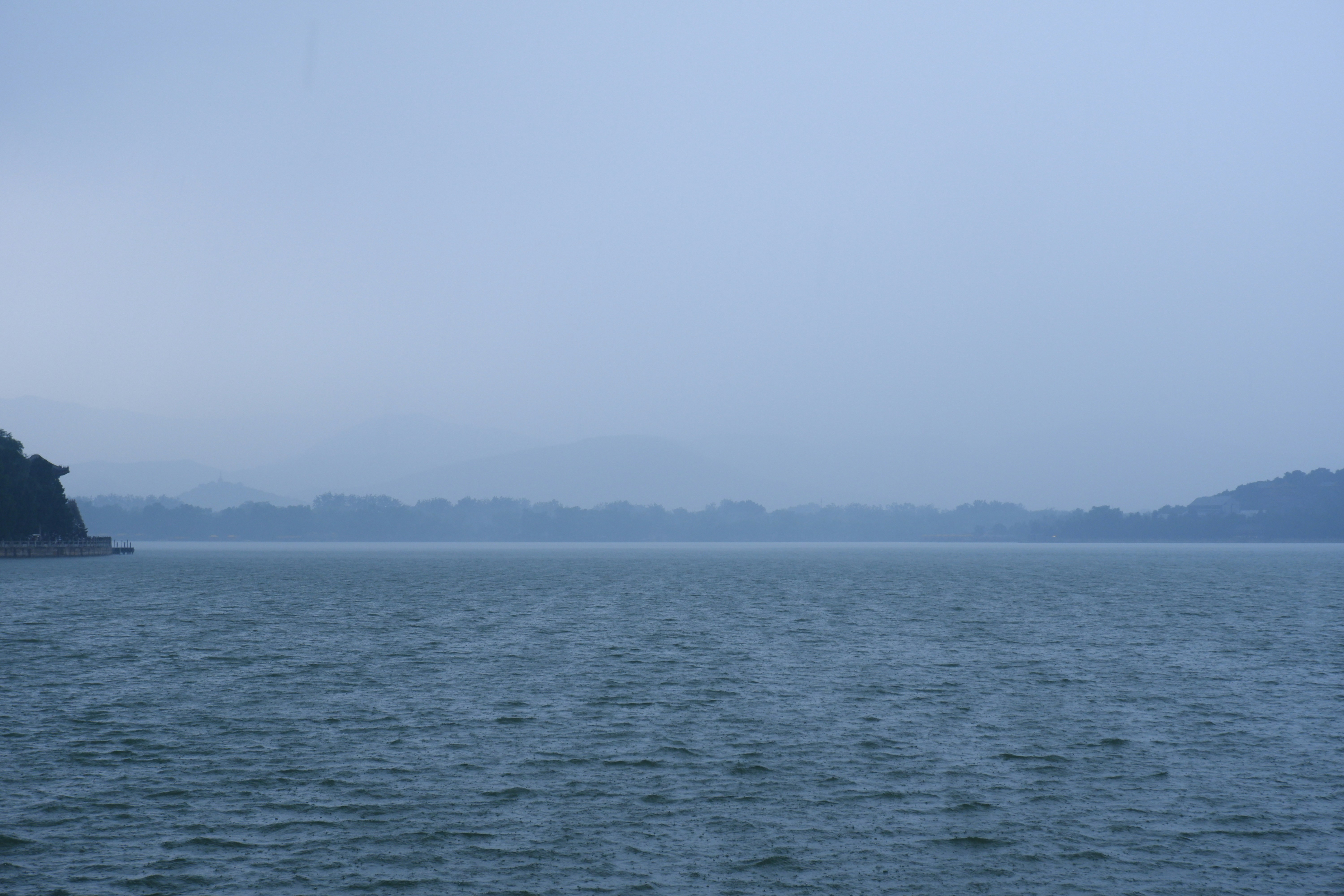 Horizon Mist Over Calm Waters