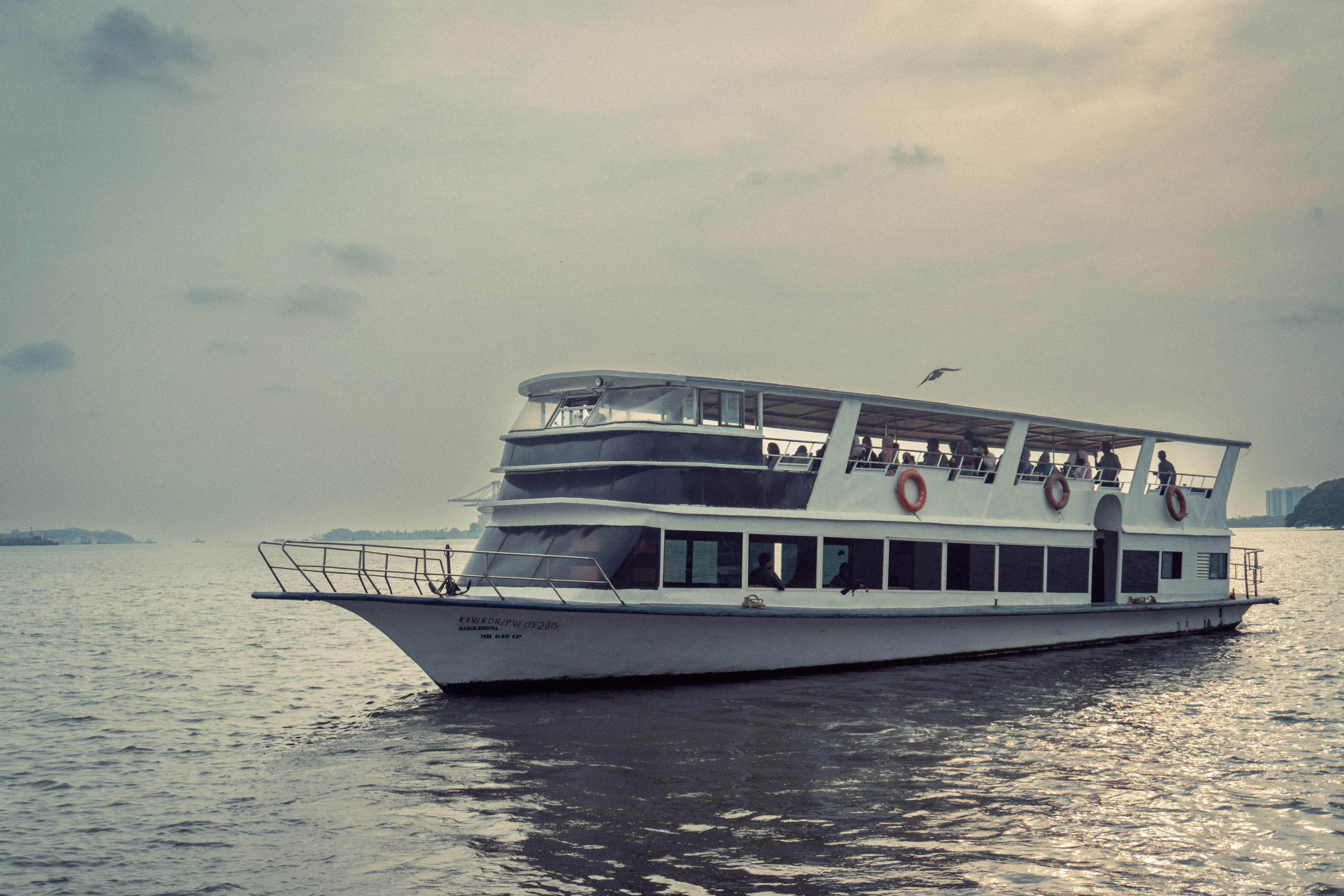 Maritime Passage at Dusk: The Passenger Vessel Drifts on Calm Waters