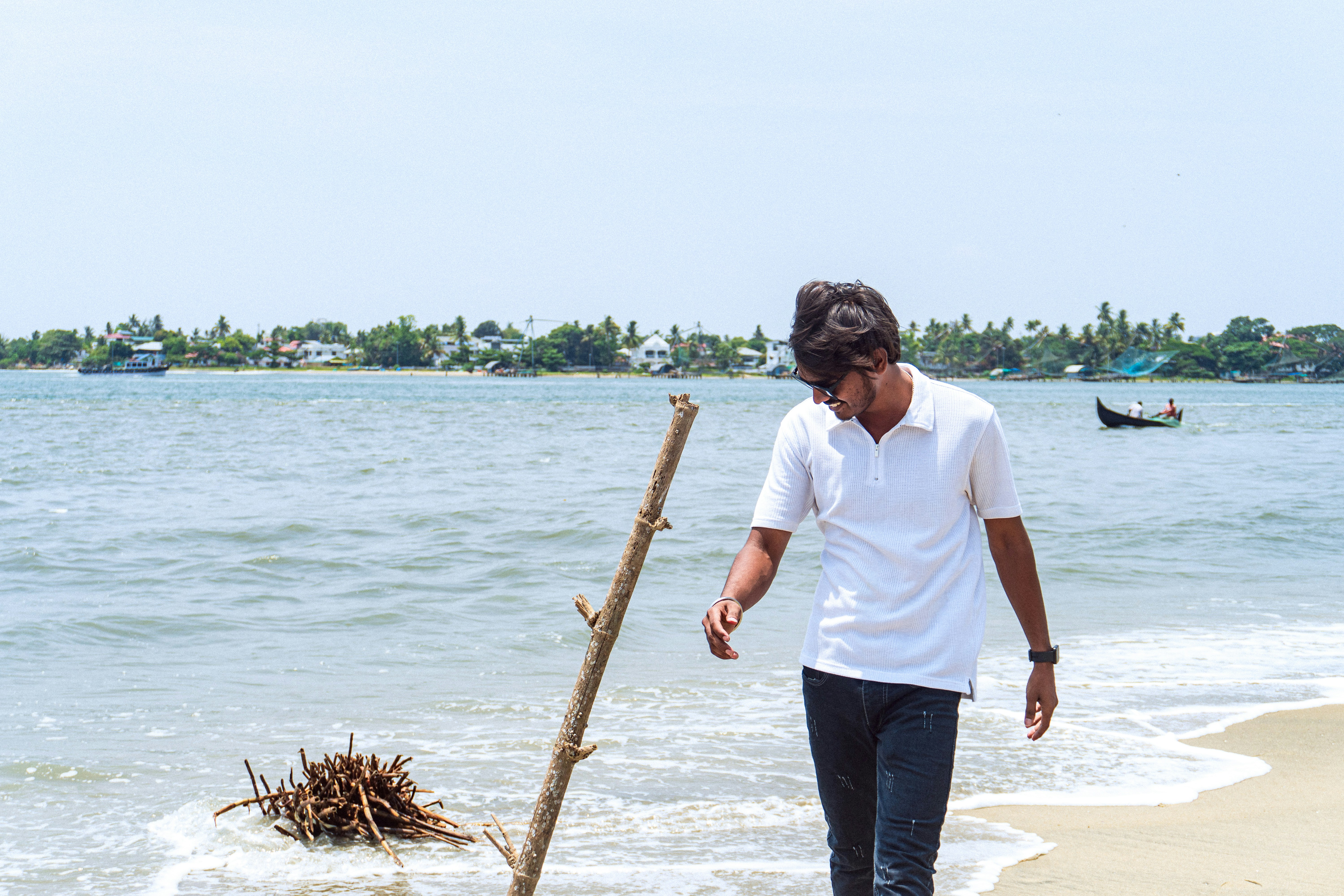 Coastal Walk: Man in White by the Tidal Shore