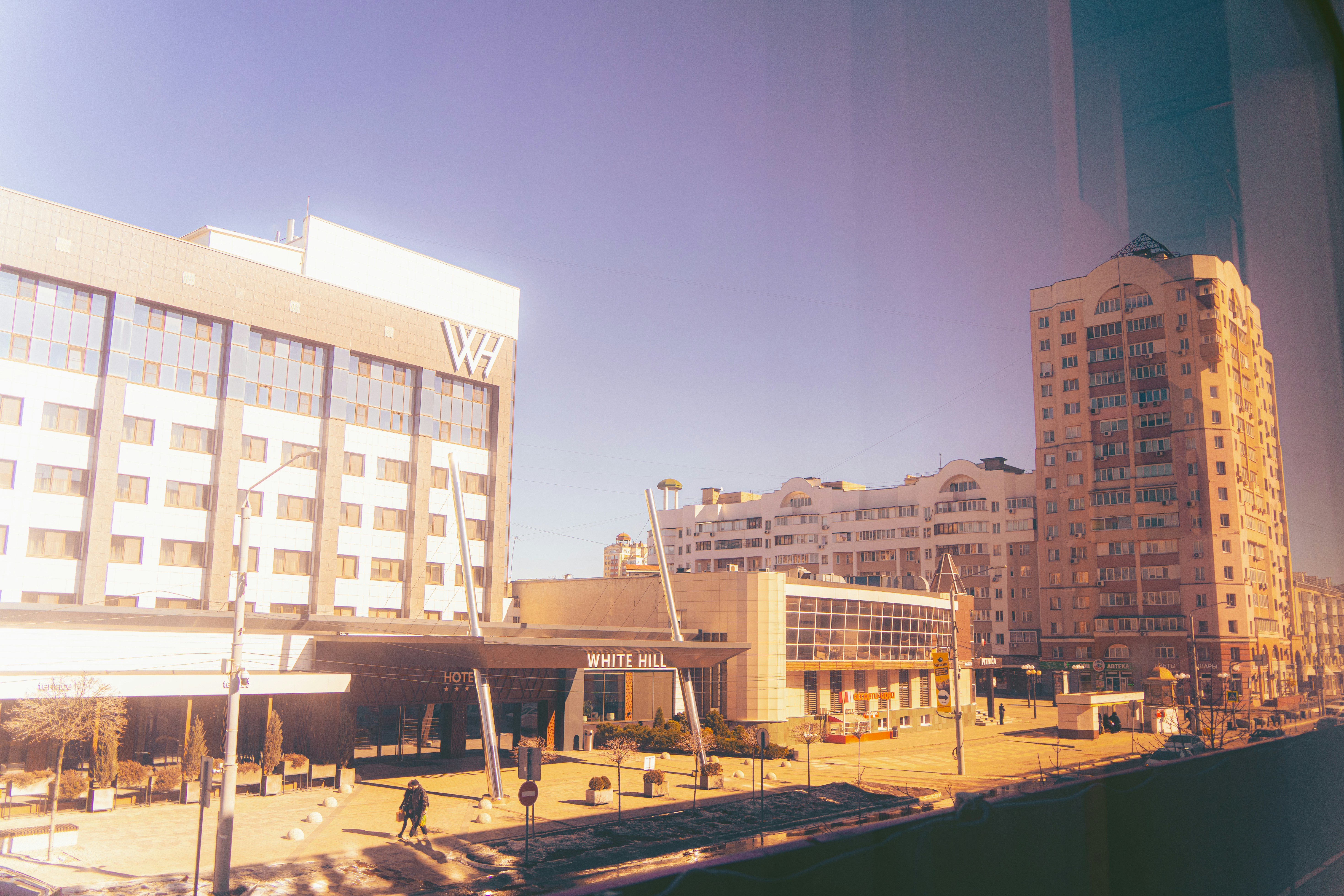 Urban Lightscape Through a Faded Window