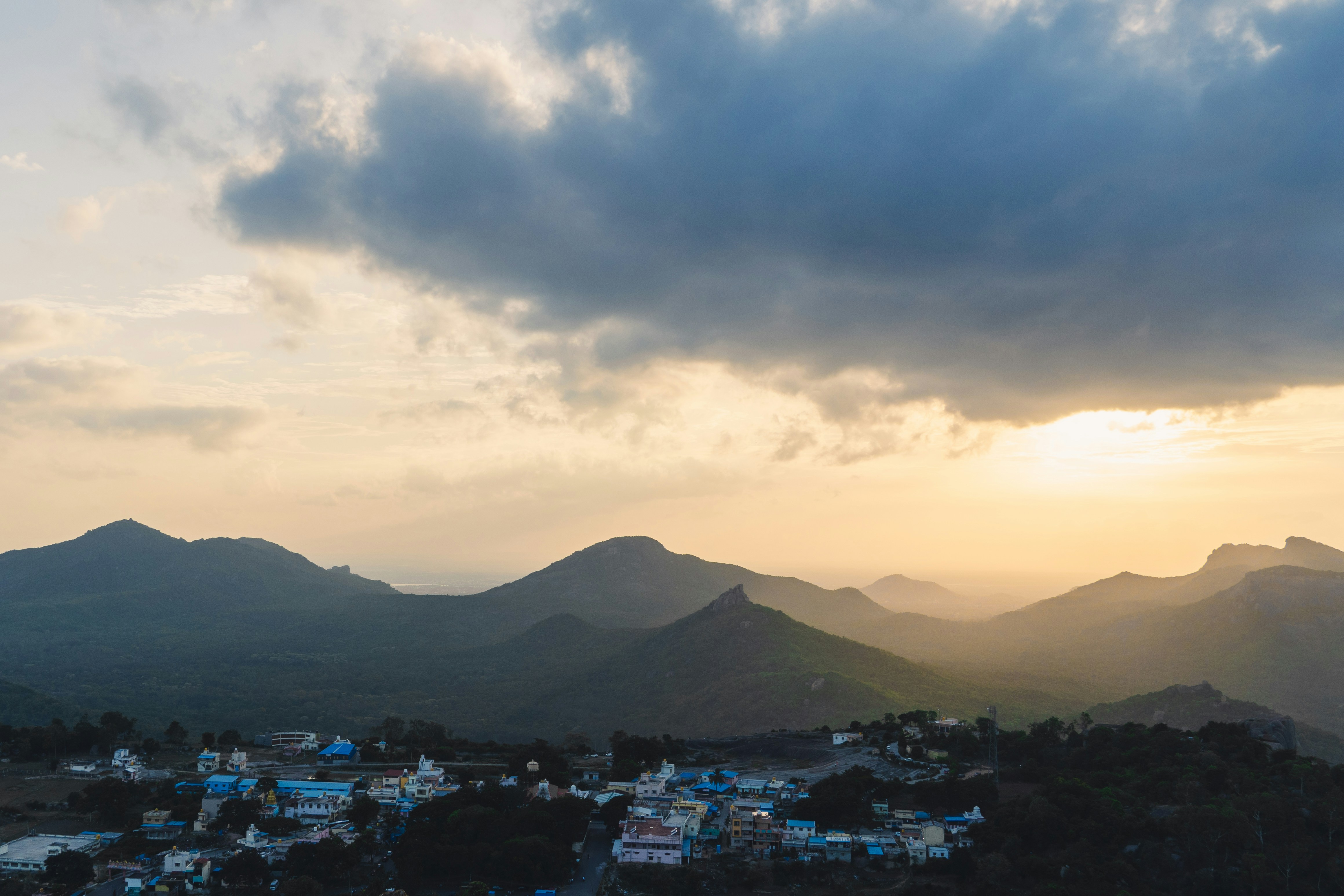 Dawn Over Velvet Hills: A Quiet Town Beneath Cerulean Skies