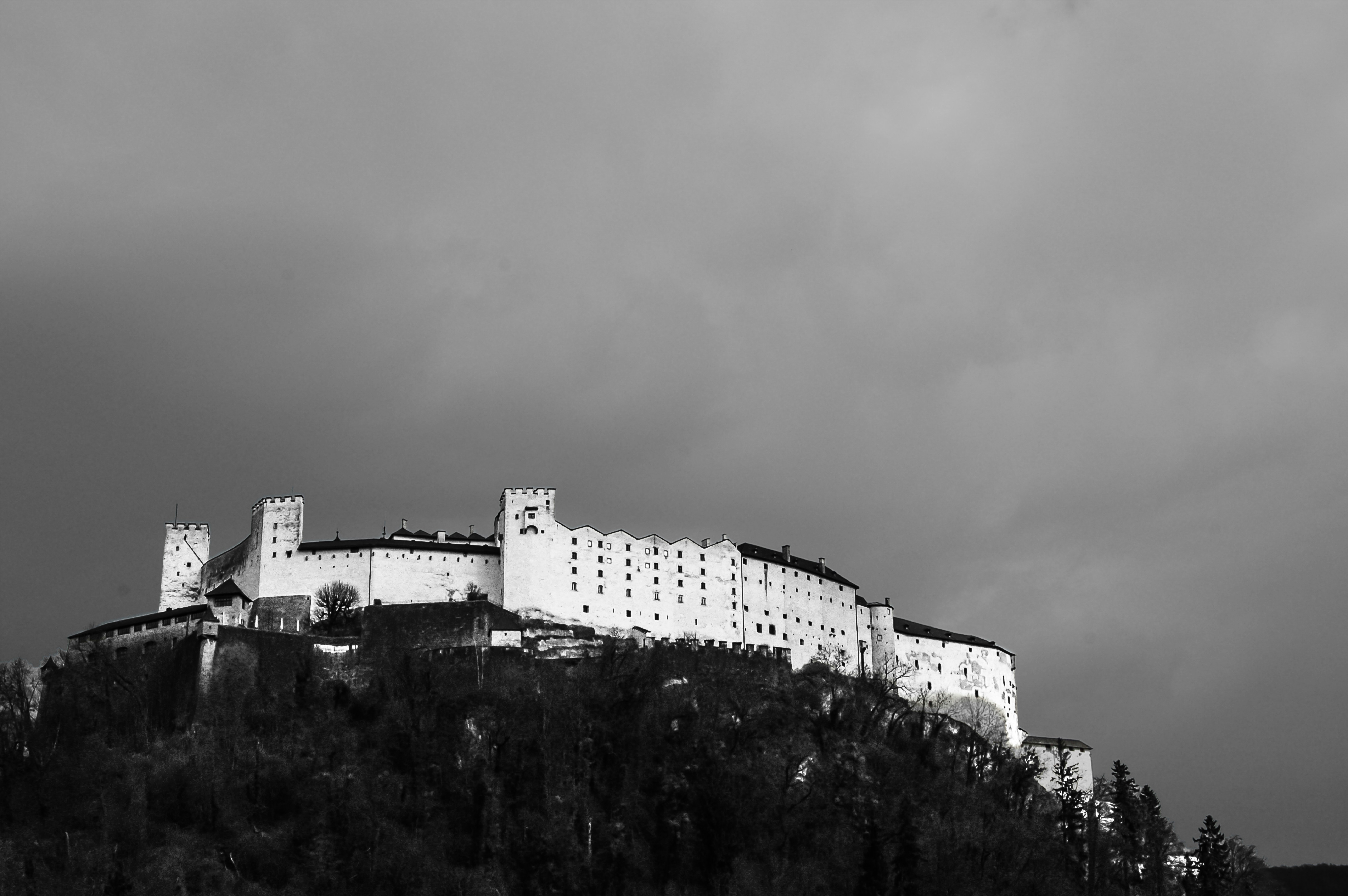 Castle on the Hill: A Monochrome Sentinel Overlook