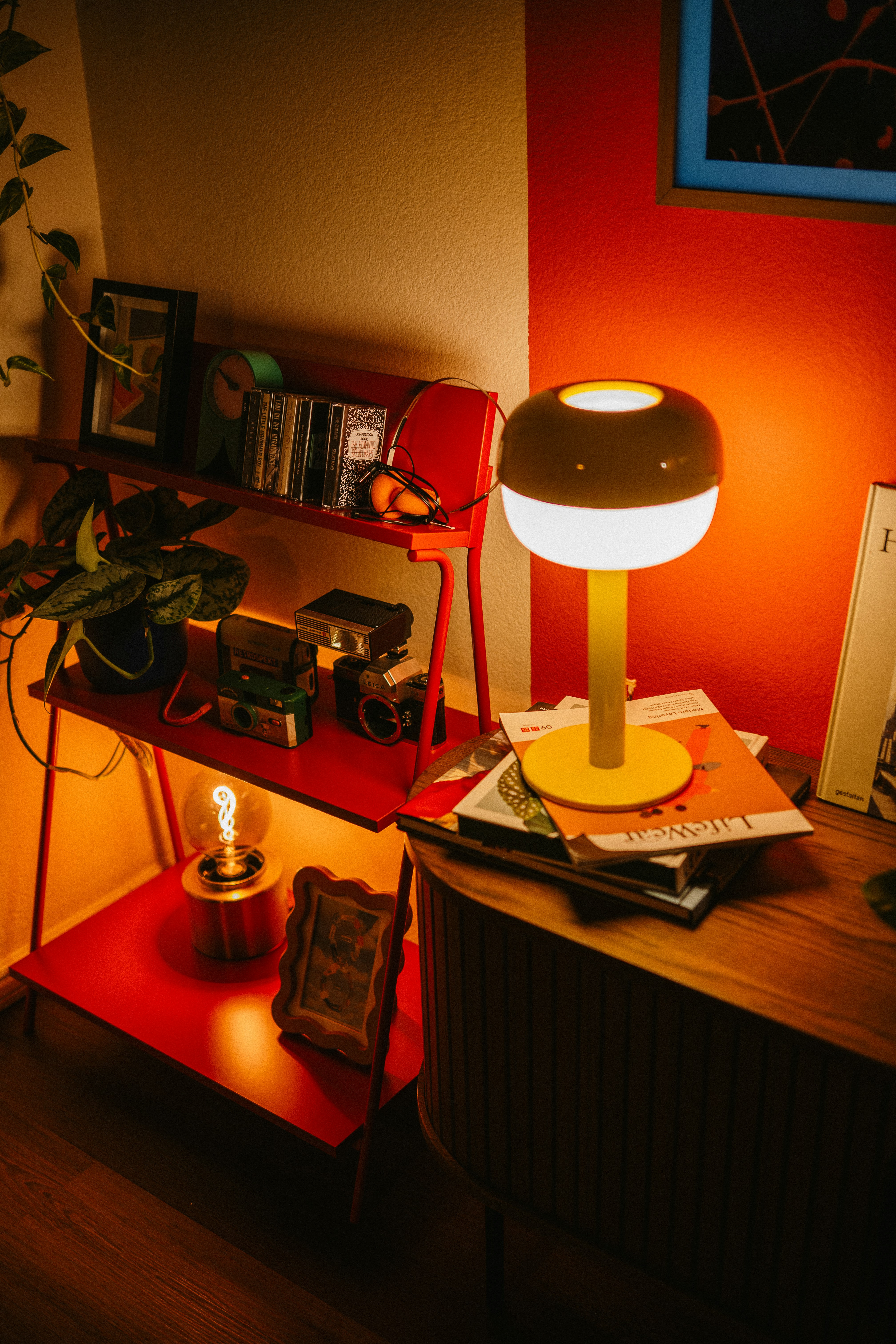 Warm Glow in a Cozy Studio: A Retro Shelf Beside a Softly Lit Table Lamp