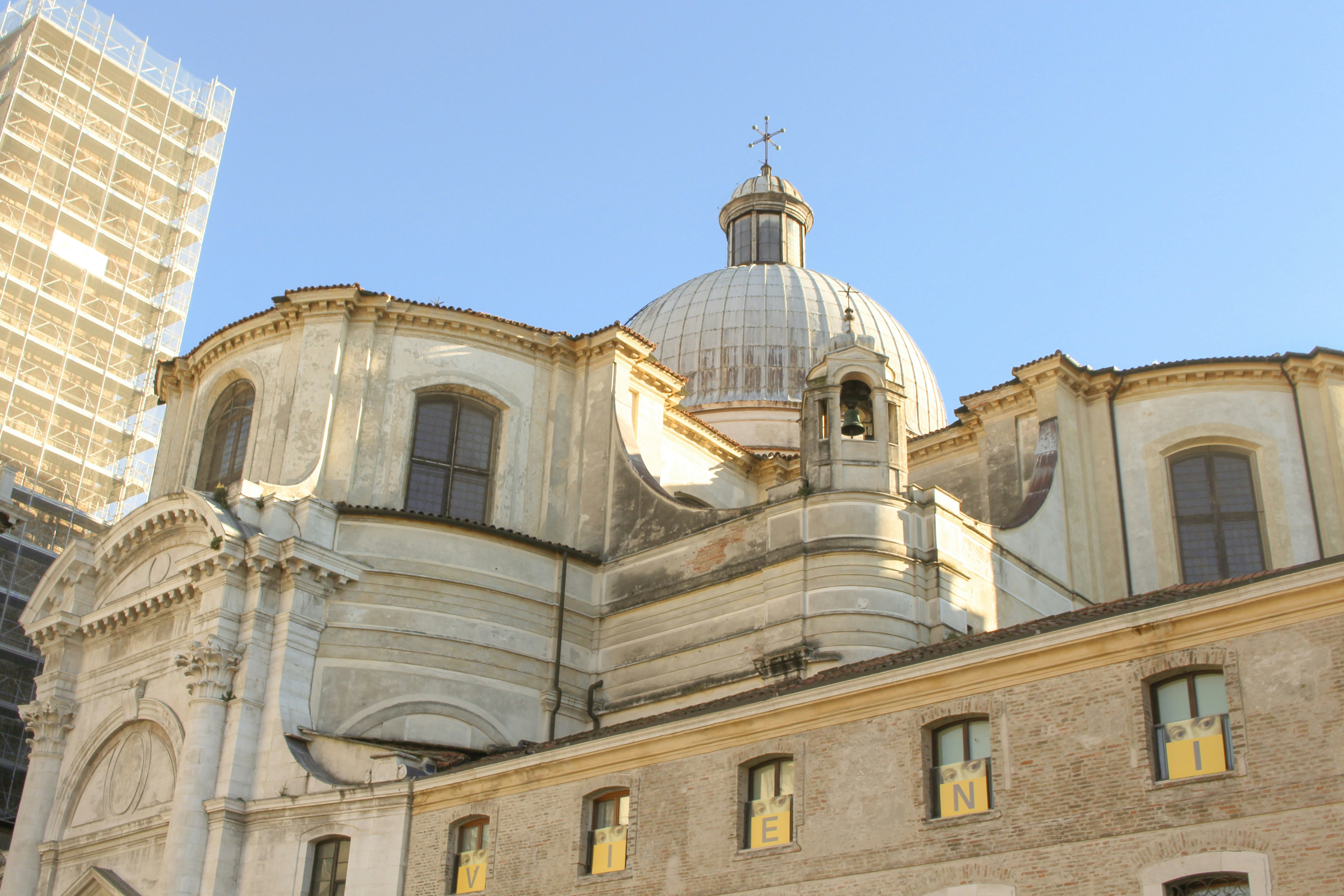 Dome and Facade of a Historic Church Against a Clear Sky