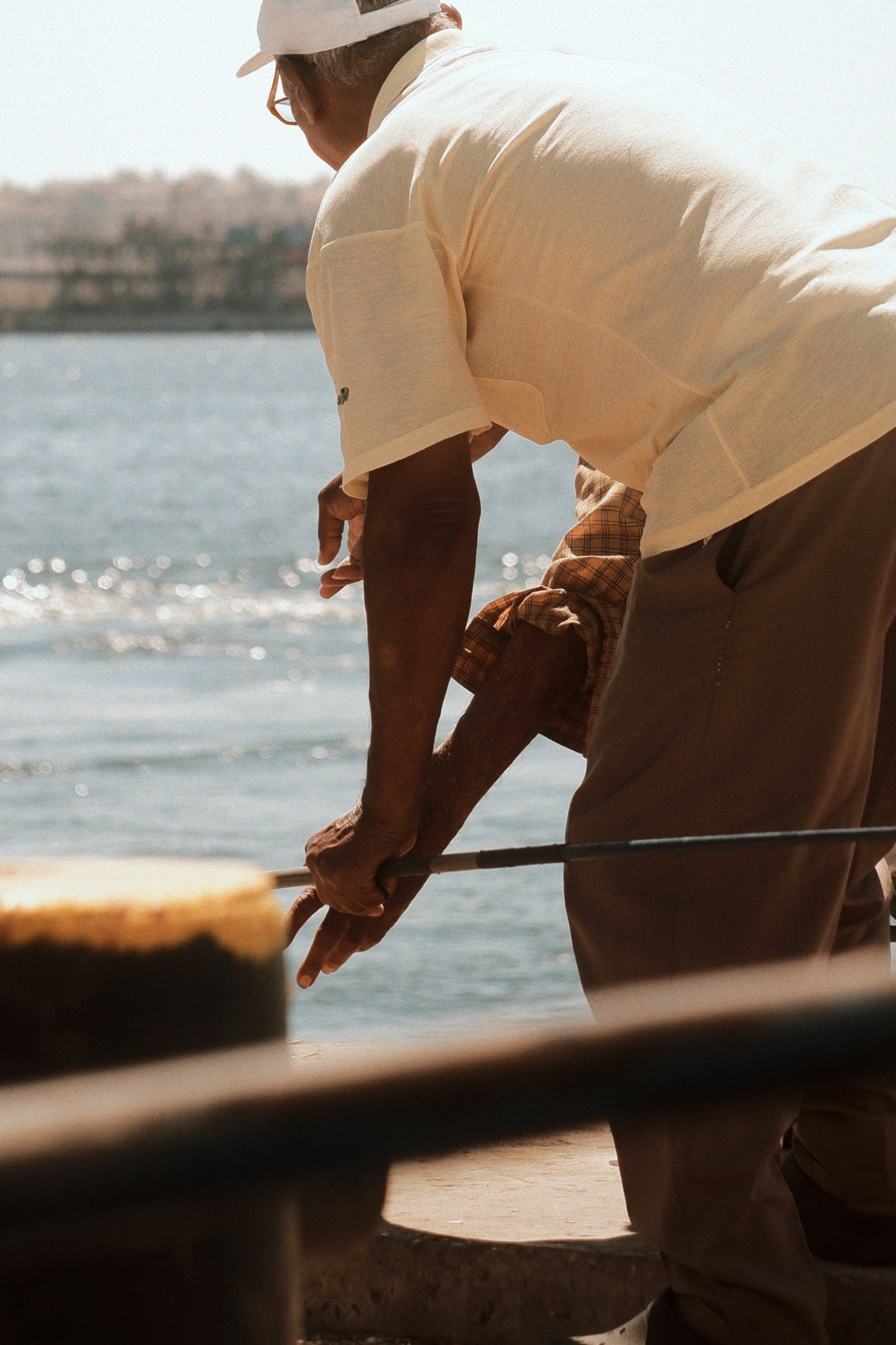 Sea Worker: A Leaning Harbor Moment at Dusk