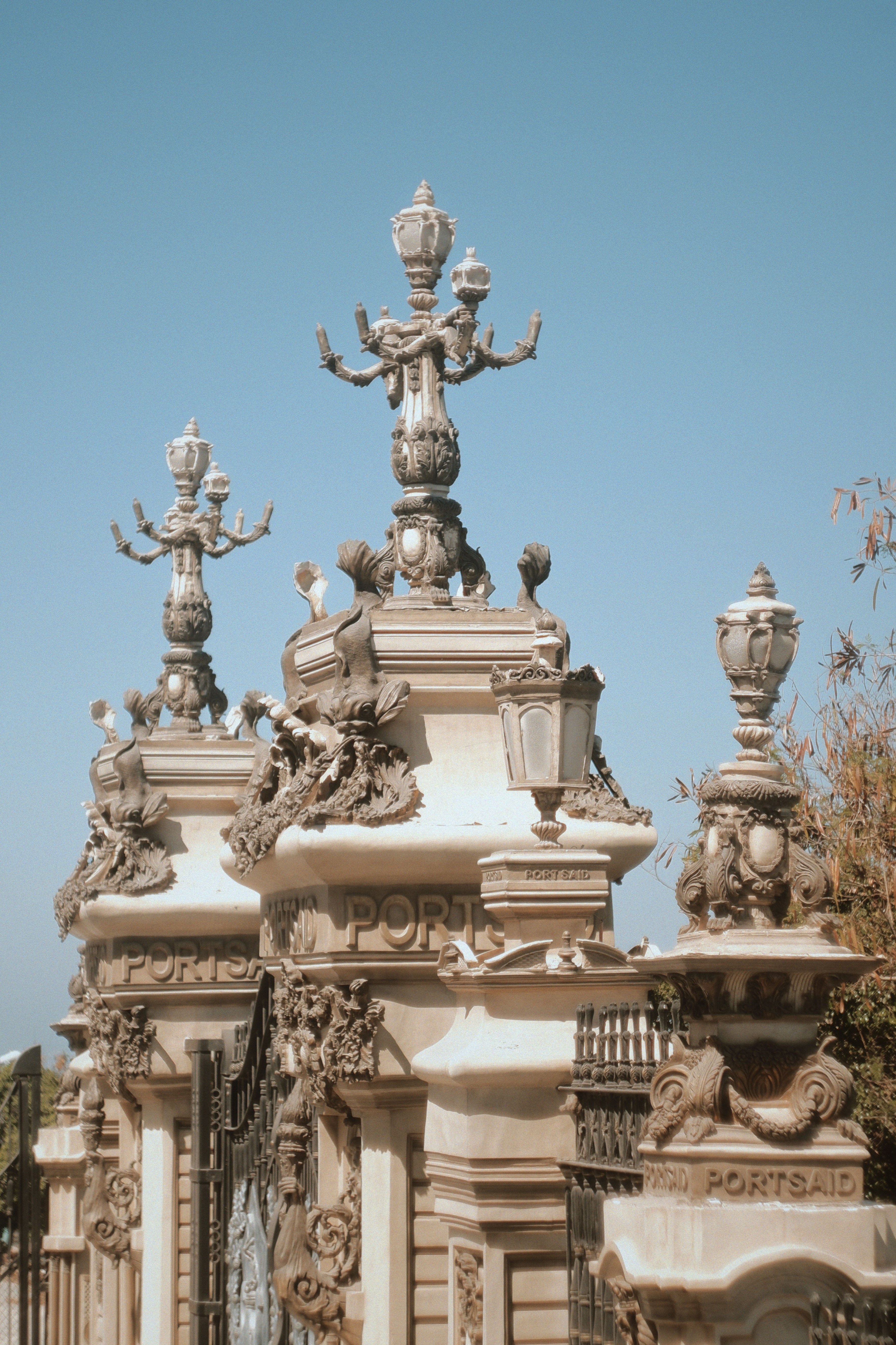 Ornate Gateposts Under a Clear Blue Sky