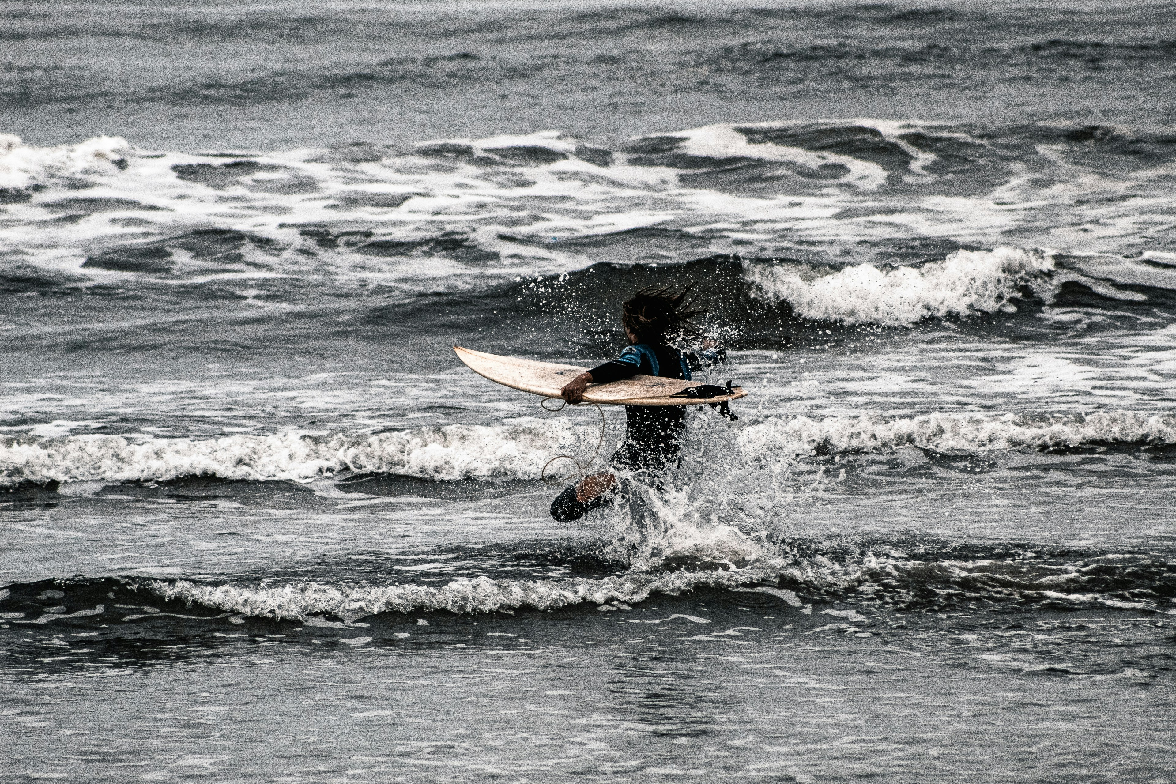 Surf Rider Emerges from a Cresting Wave