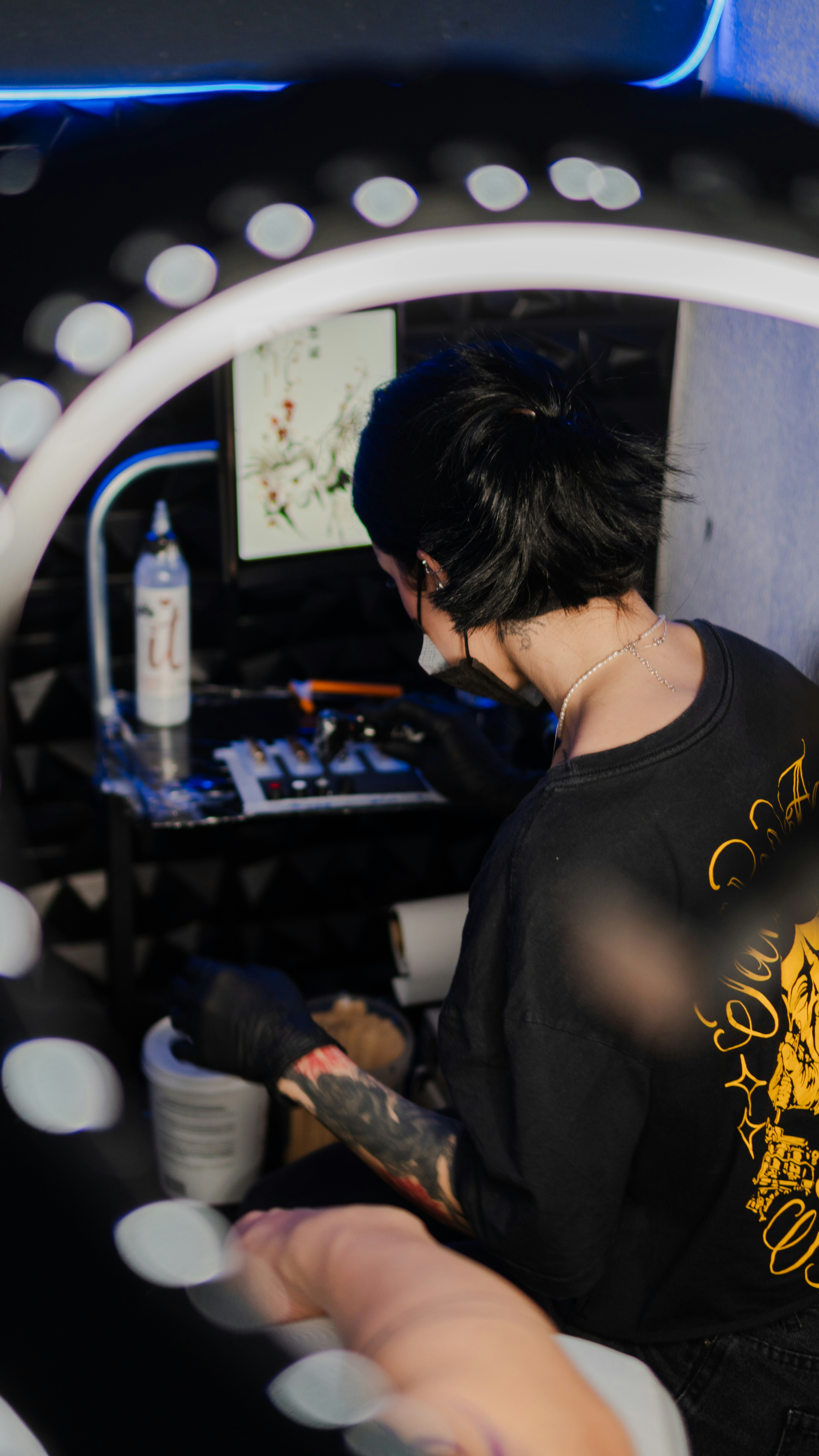 Under the Ring of Light: A Portrait in a Tattooed Studio