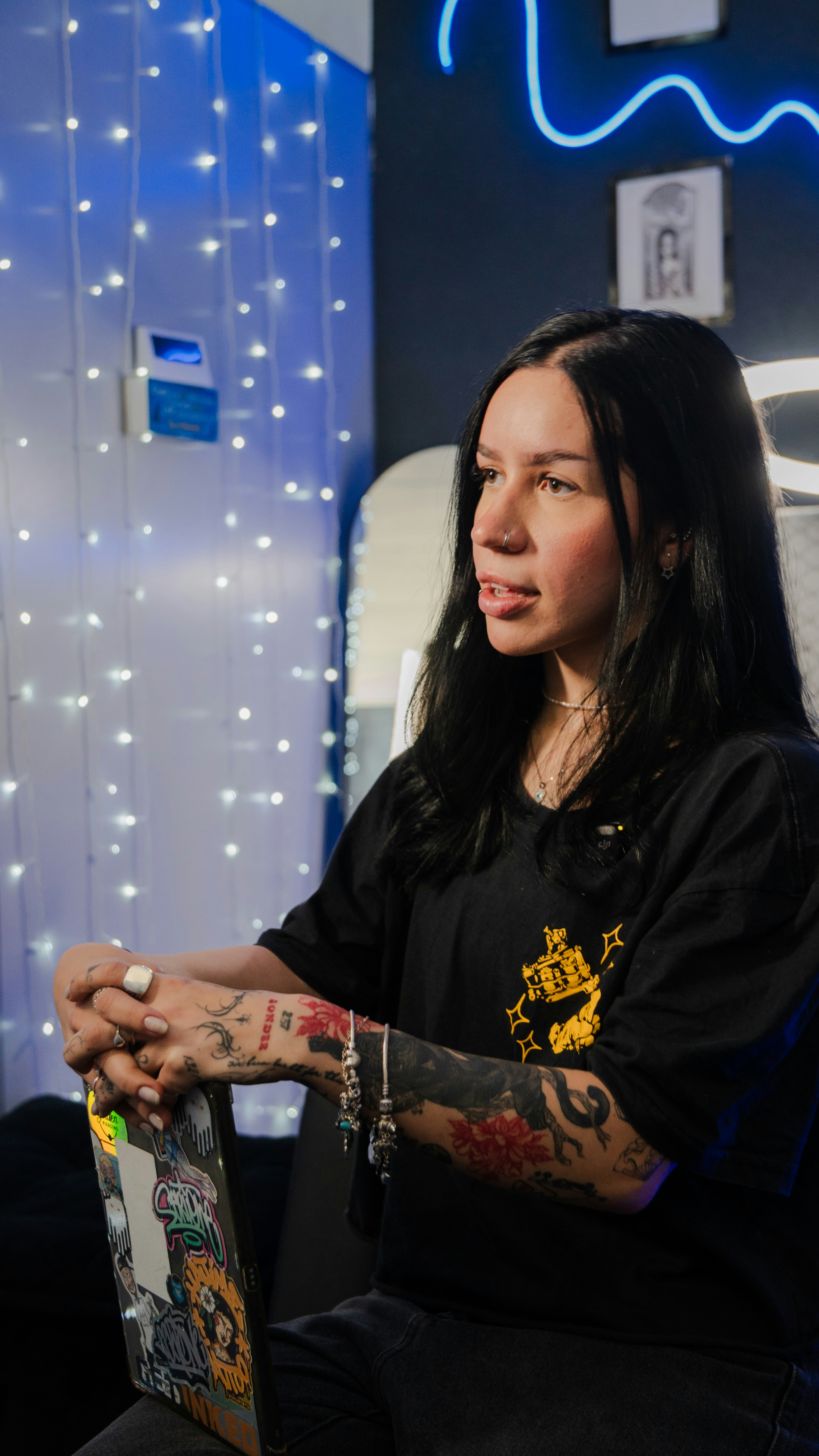 Neon-lit Portrait: A Tattooed Muse in a Studio of Lights