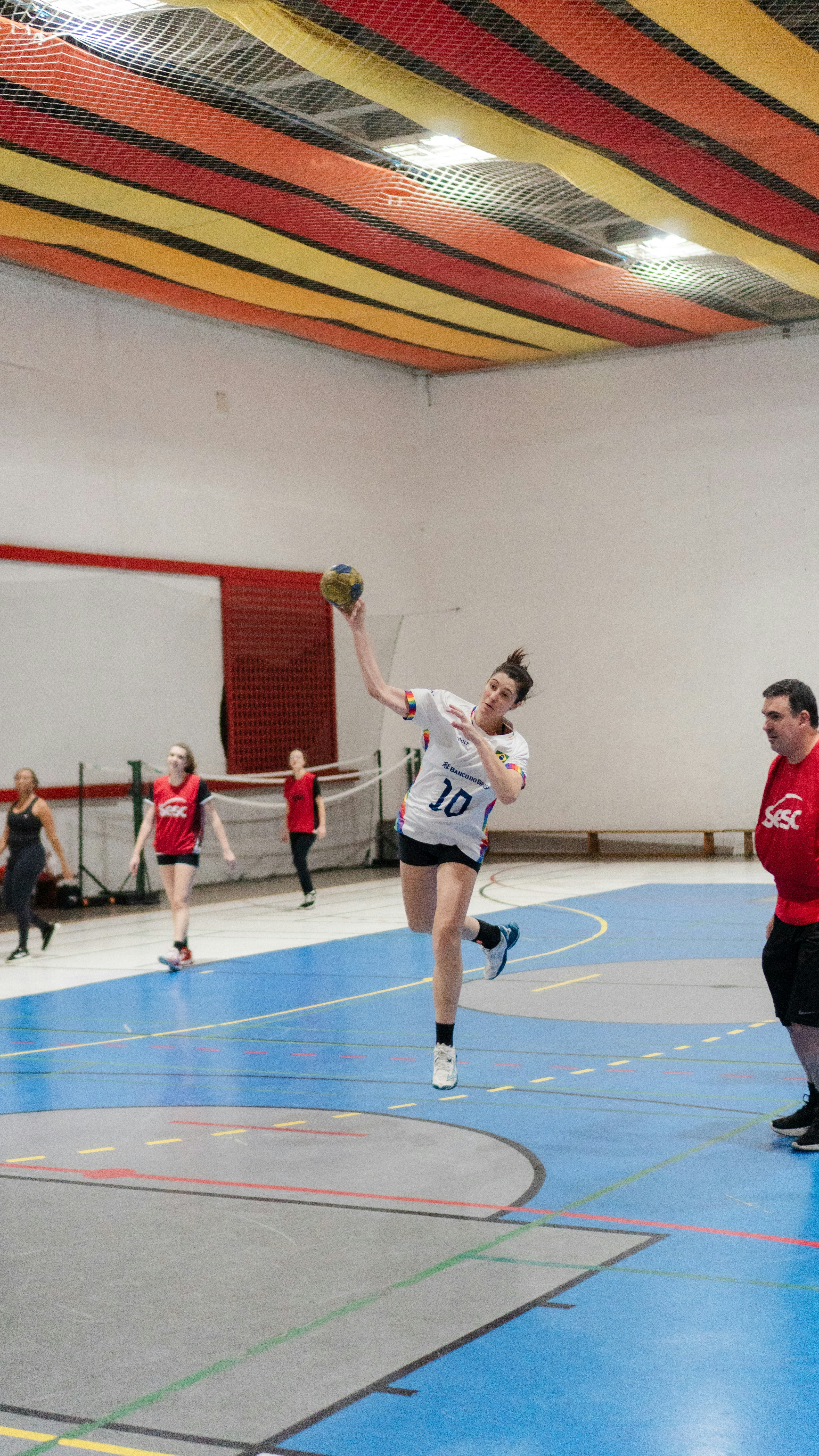 High-arch Victory: Handball Athlete Soars for the Win