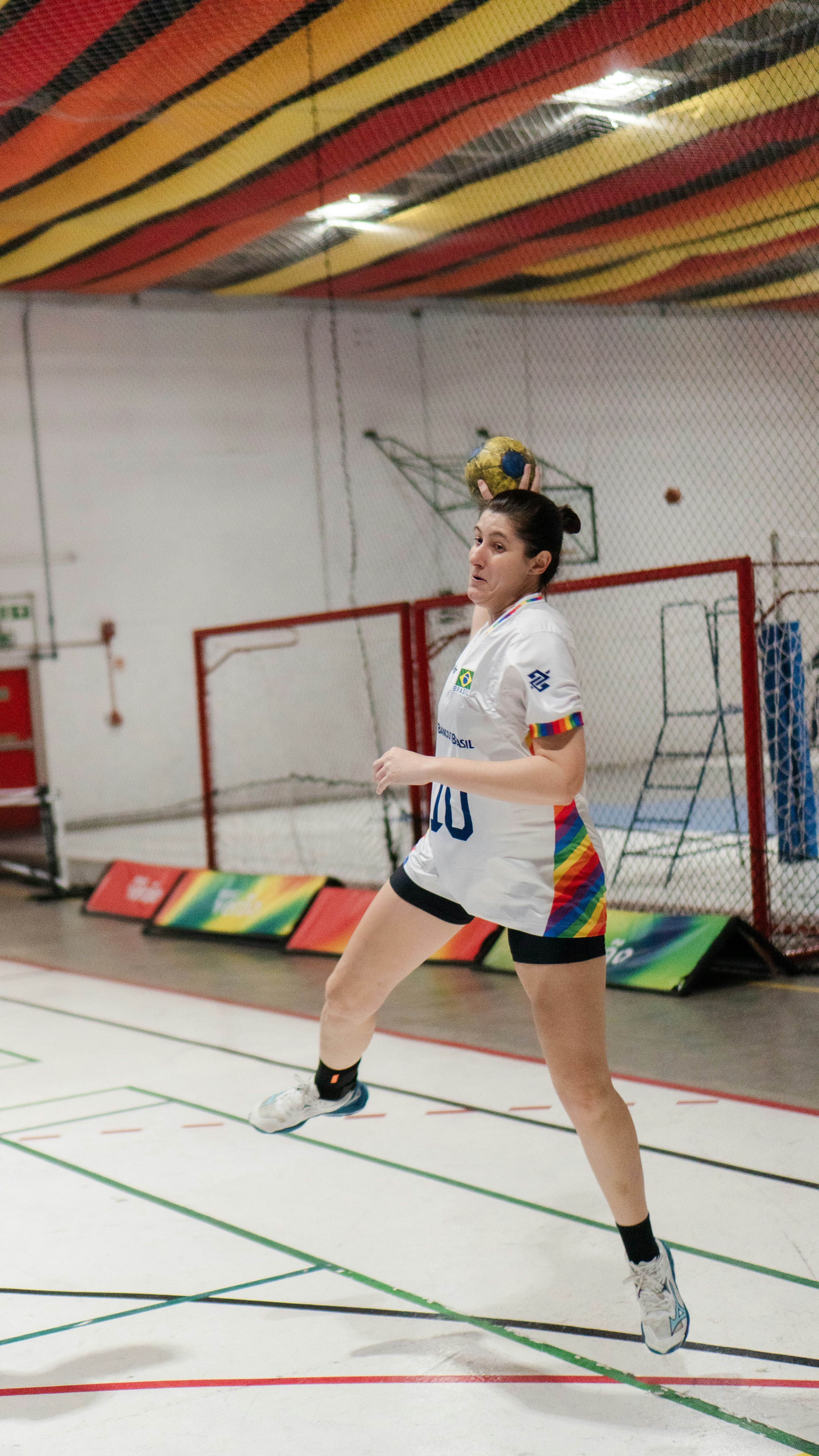 Mid-Air Rally: Athlete in a Live-Action Indoor Sport