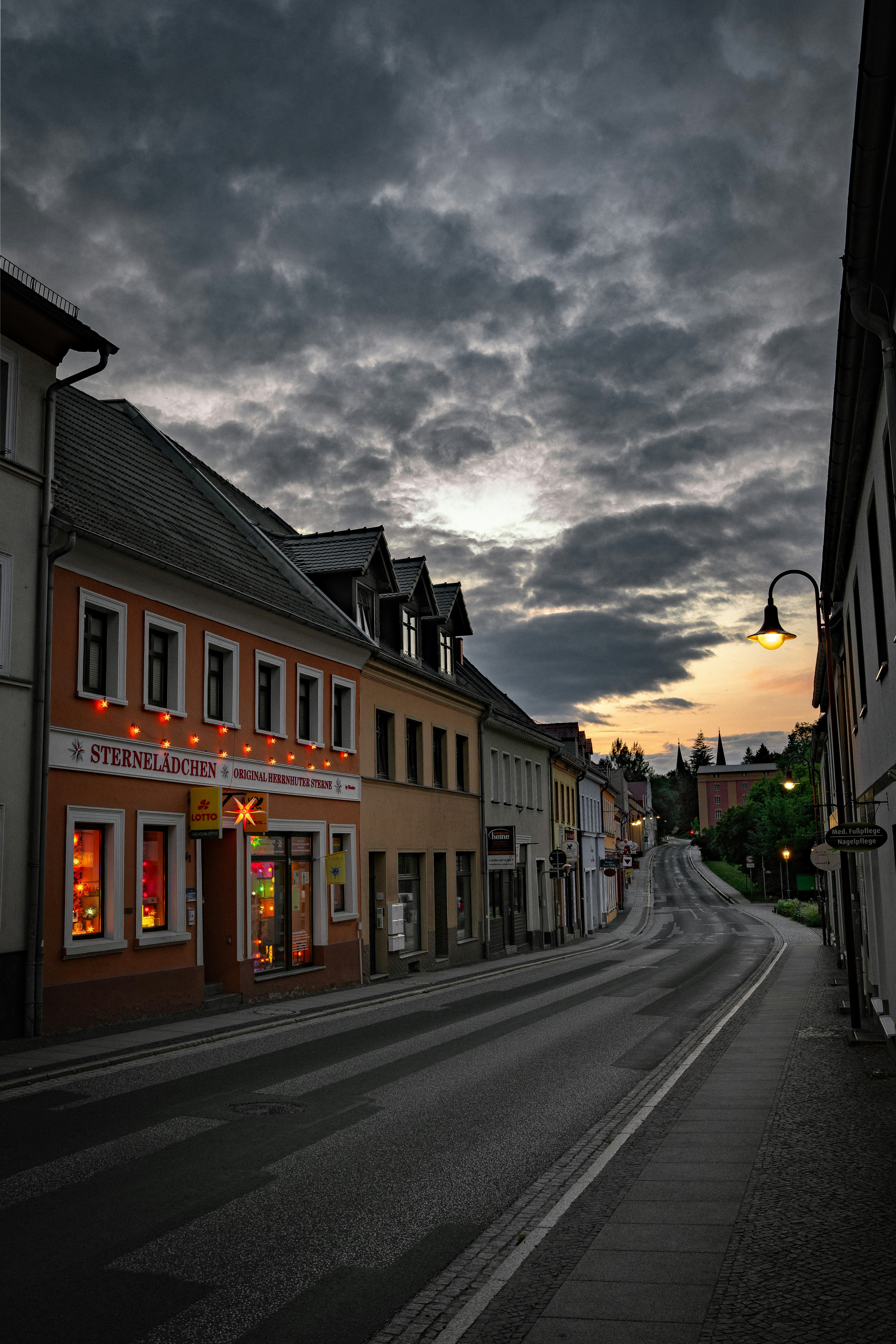 Evening Streetlights on a Quiet European Corridor