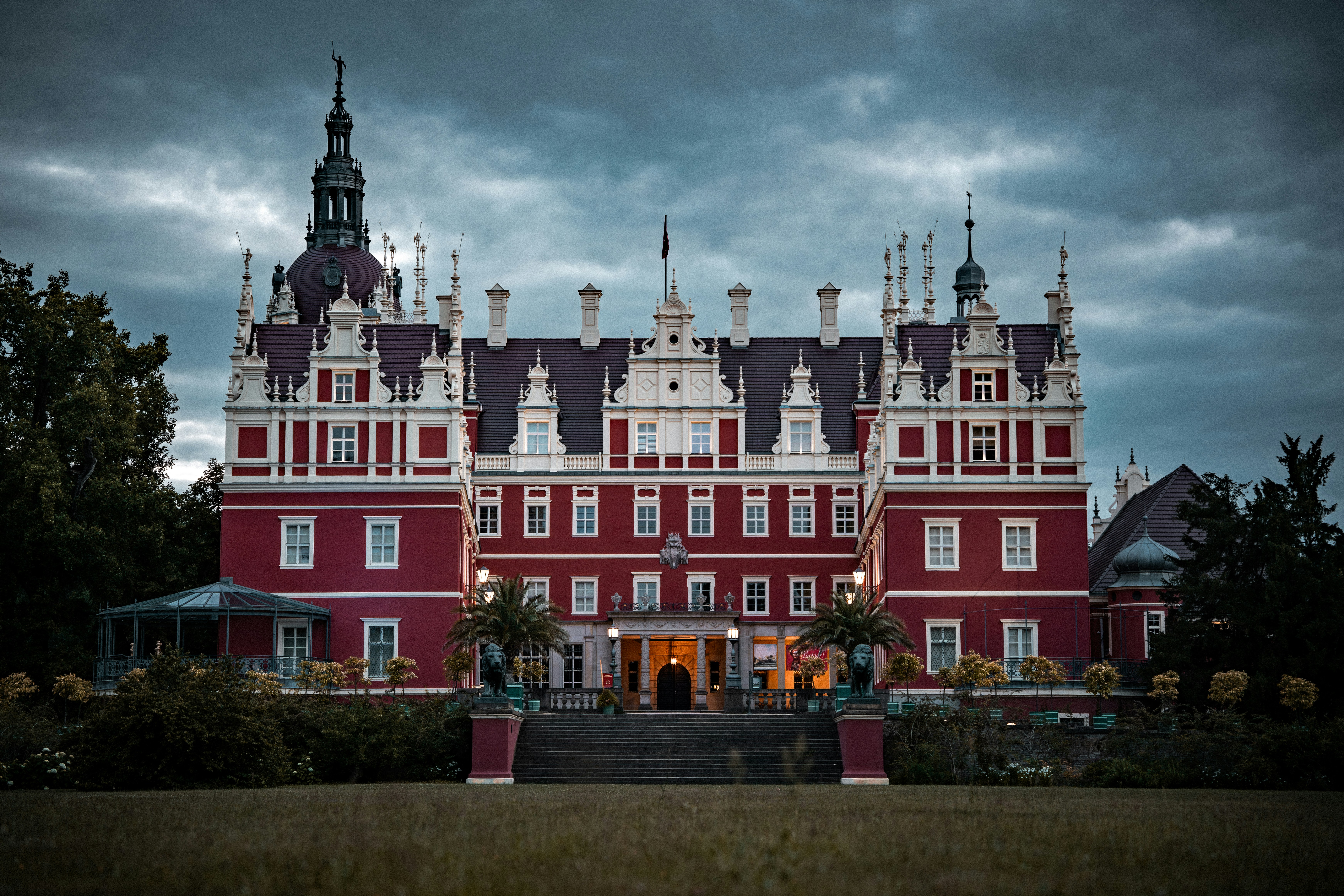 Red Castle at Dusk: A Victorian Palace Emerges from the Evening Cloud