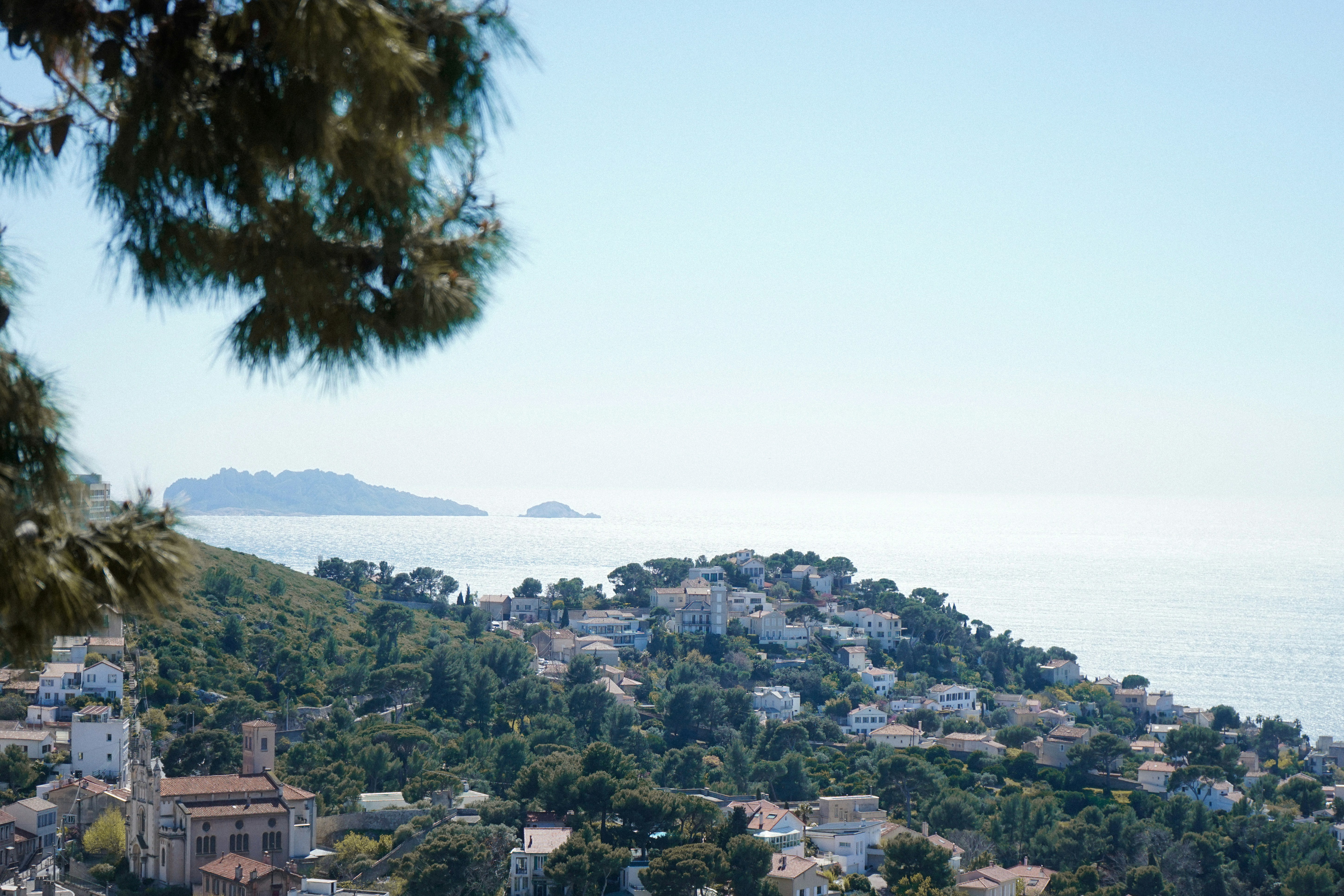 Coastal Village Terrace: A Panoramic Sea View Over Rooftops and Olive Grove