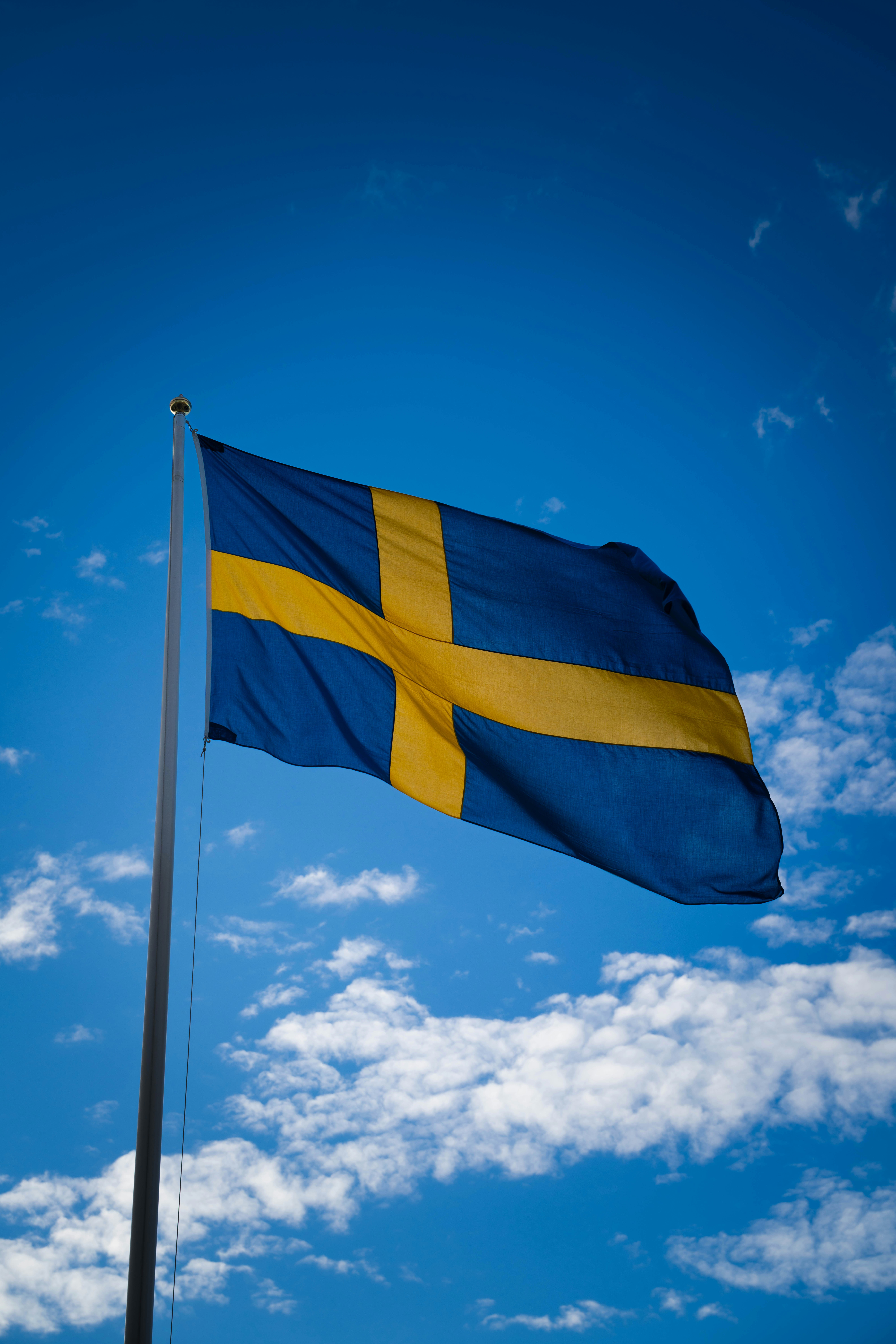 Flag of Sweden against a bright daytime sky