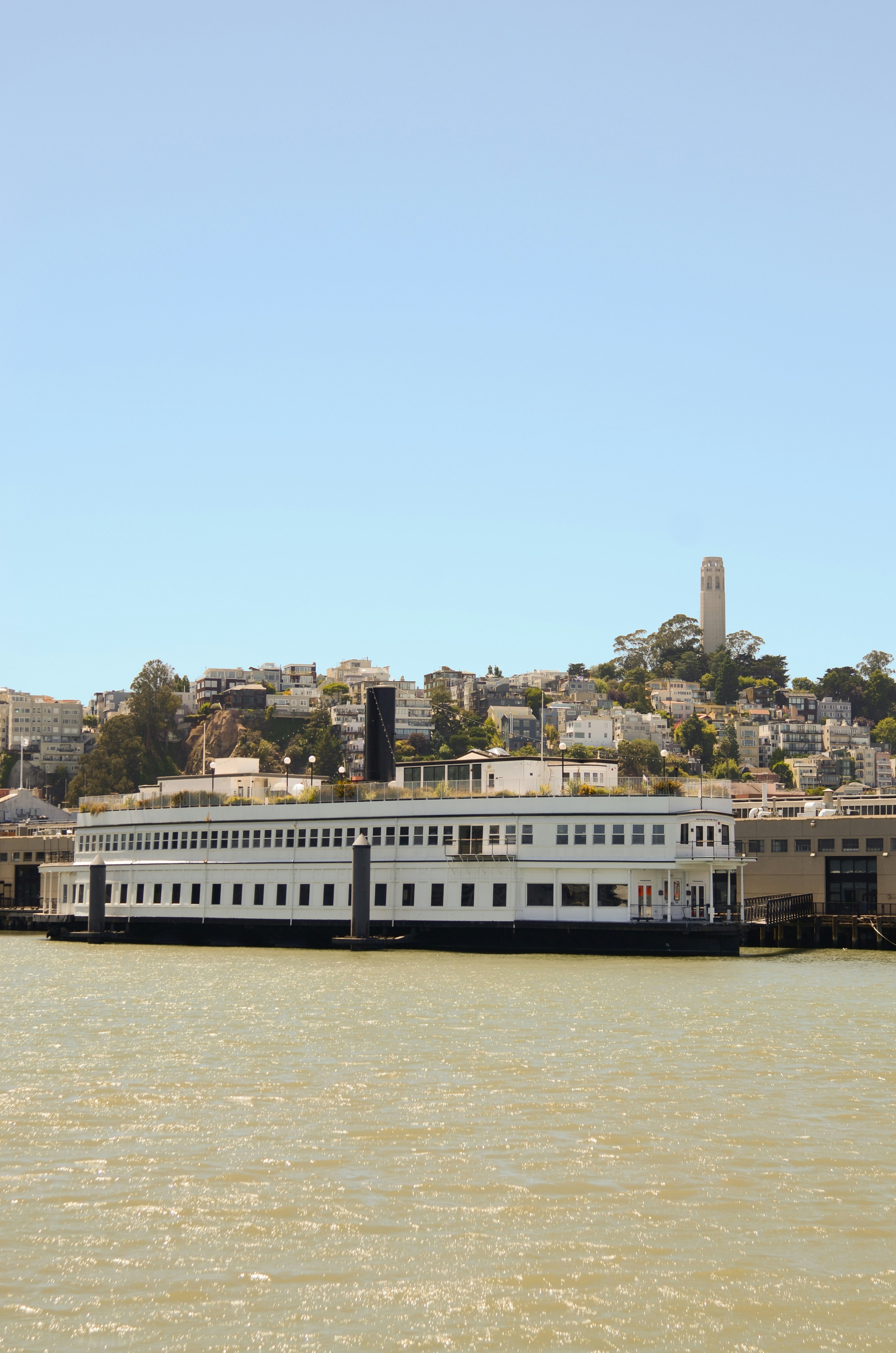Sunlit Wharf: A Maritime Town Basks Under Clear Skies