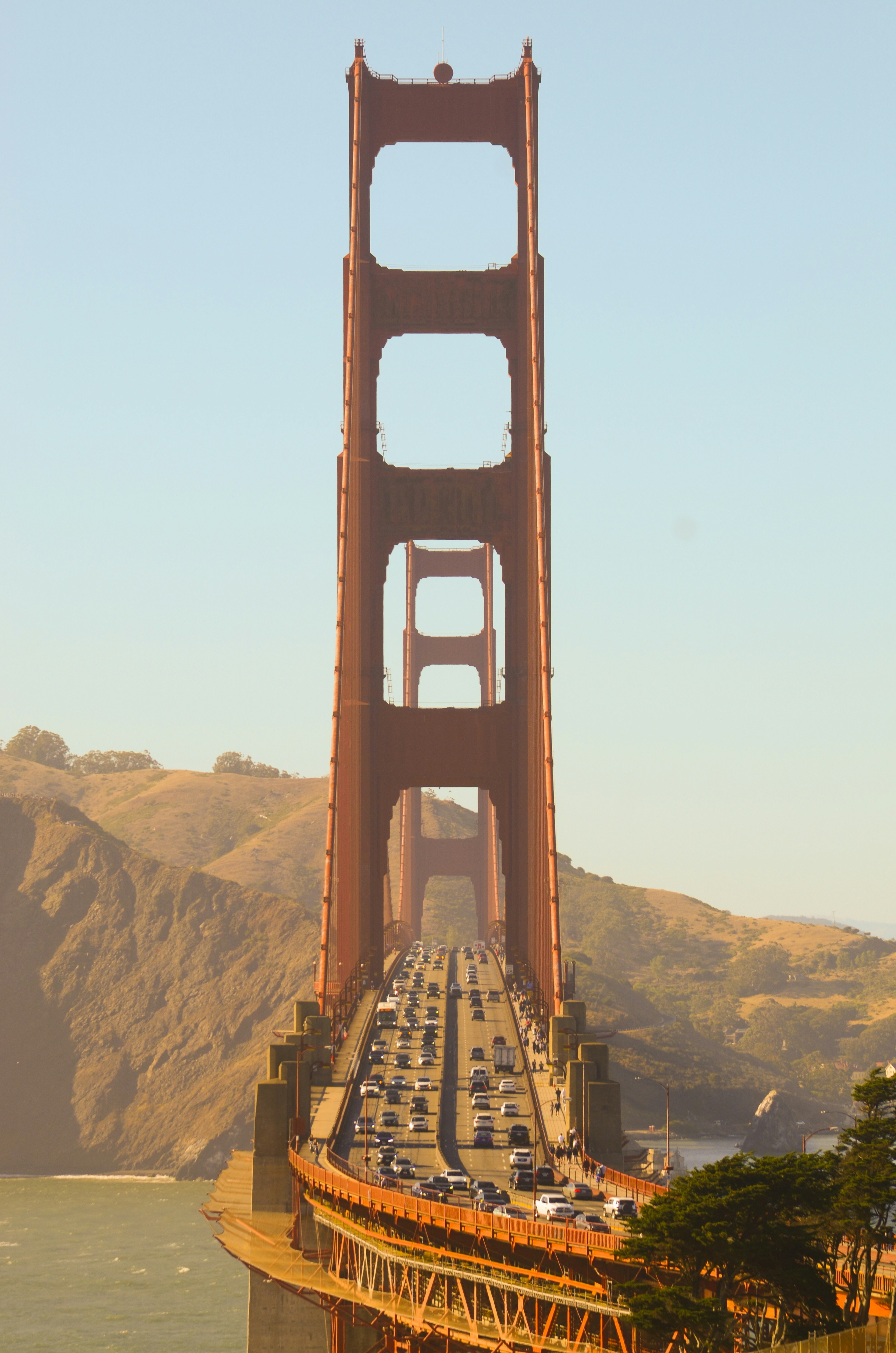 Golden Gate Silhouette: A Looming Bridge Tunnels a Sea of Traffic