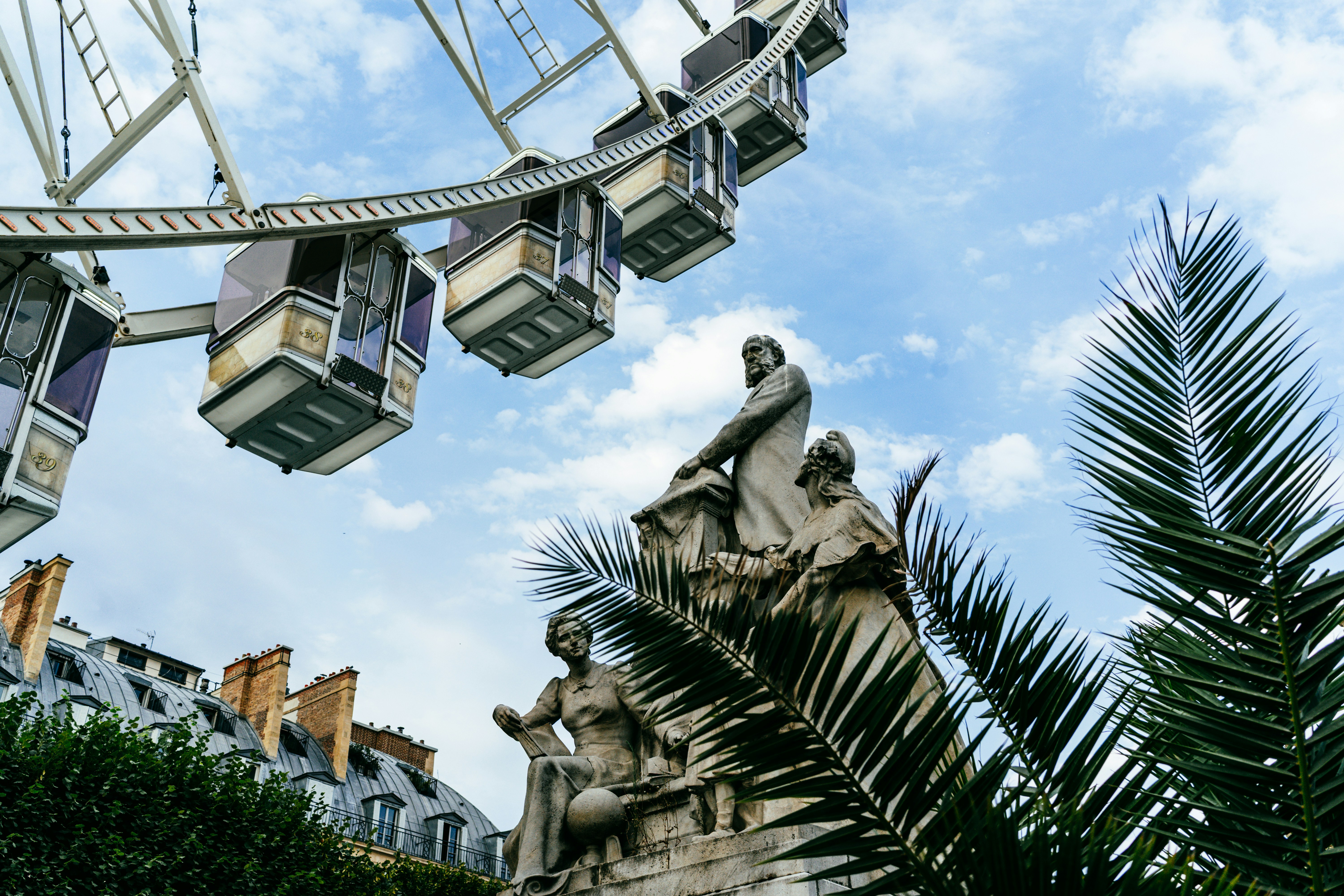 Giant Wheel over an Urn of Stone Figures