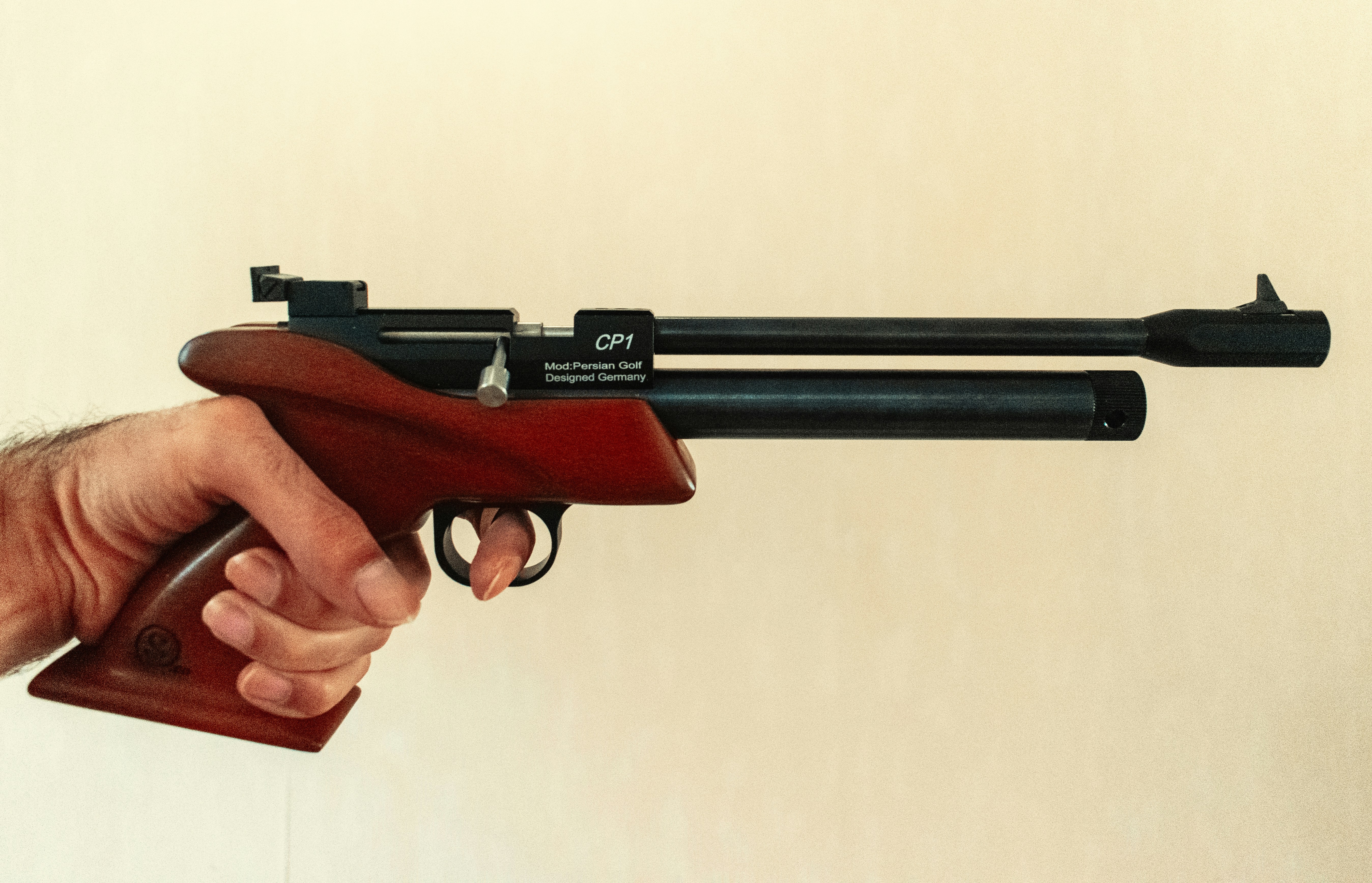 Precision in Focus: The Classic Wooden-Grip Revolver Extended