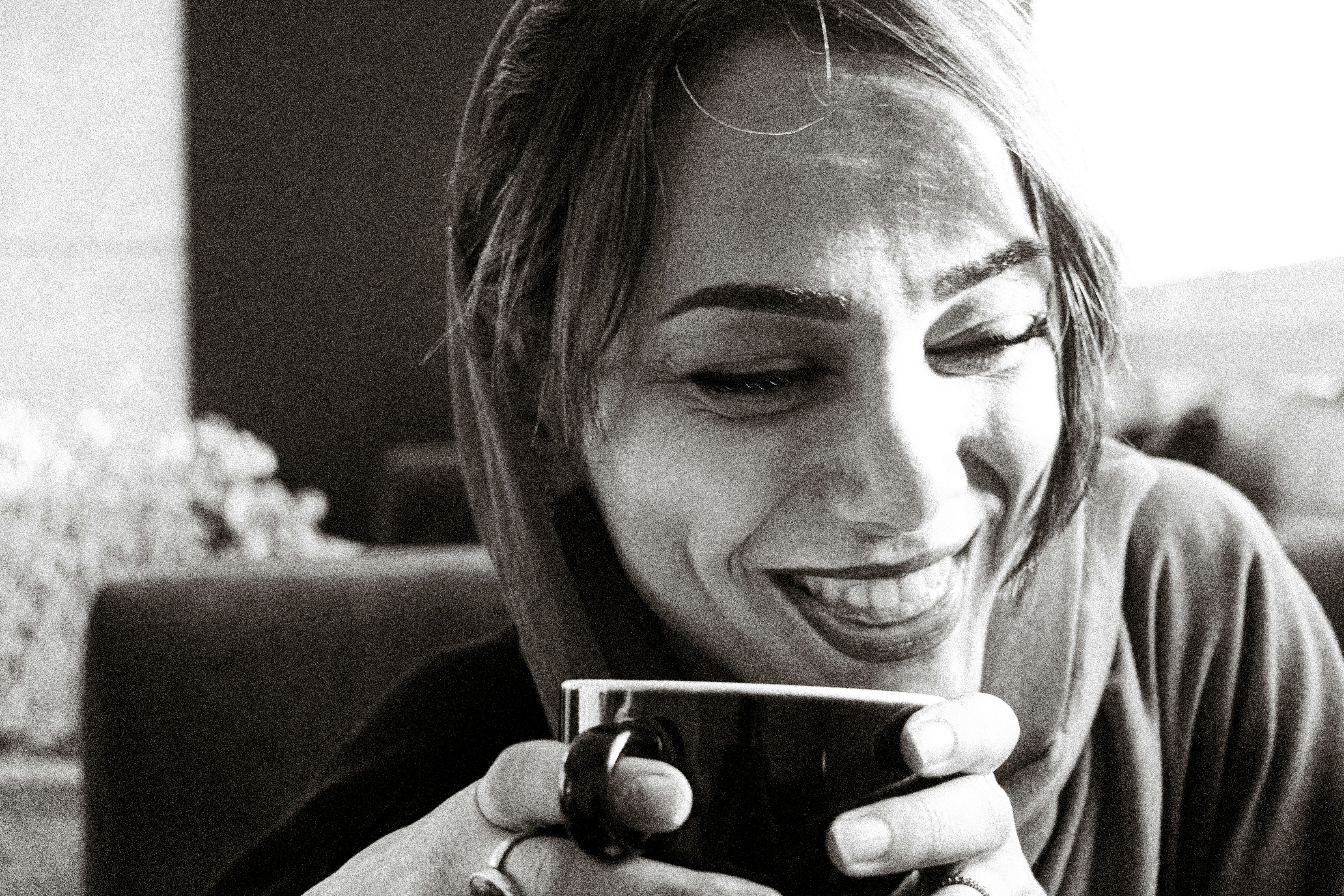 Smiling Moment Over Coffee on a Quiet Terrace