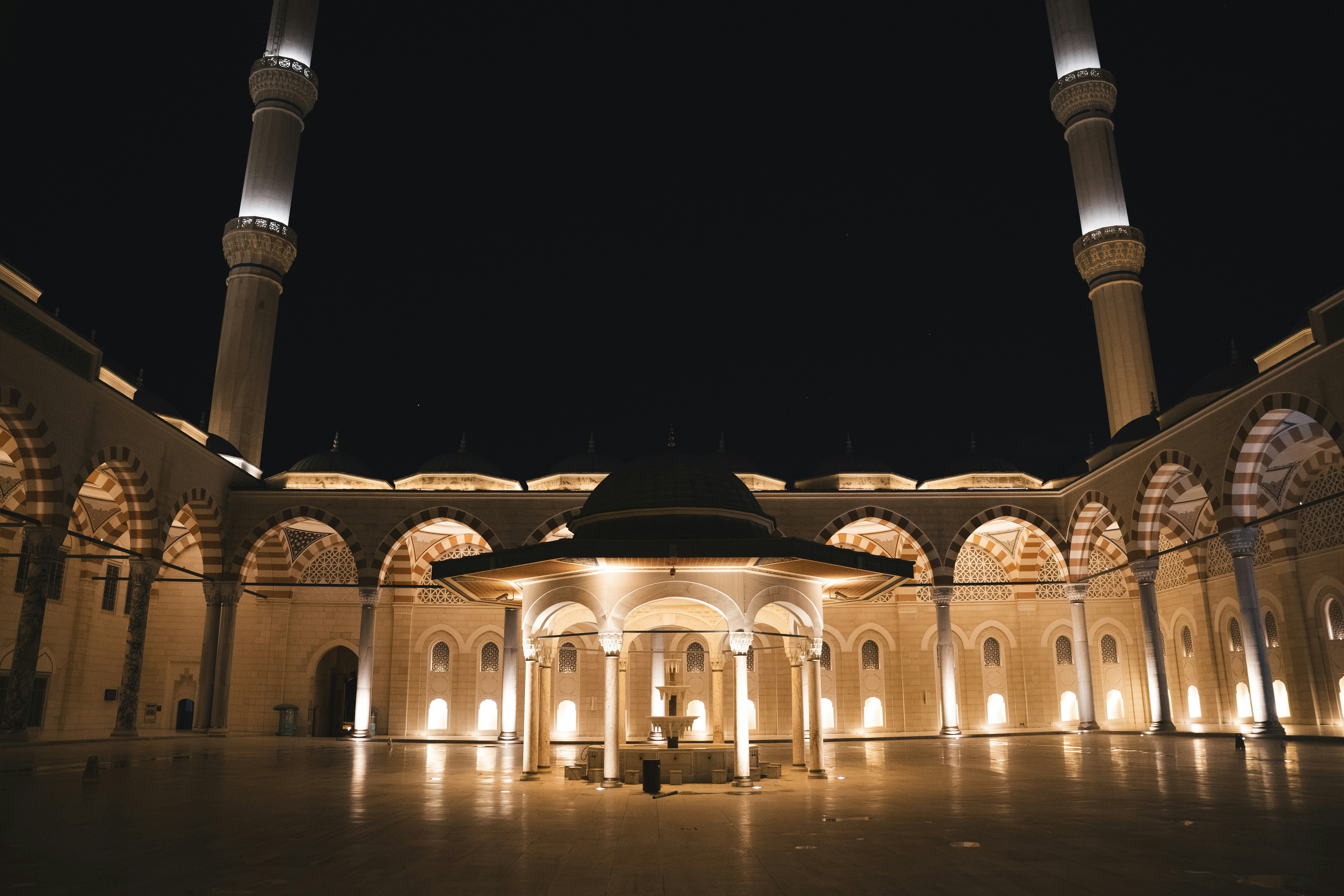 Moonlit Courtyard: Lantern-lit arches and central pavilion