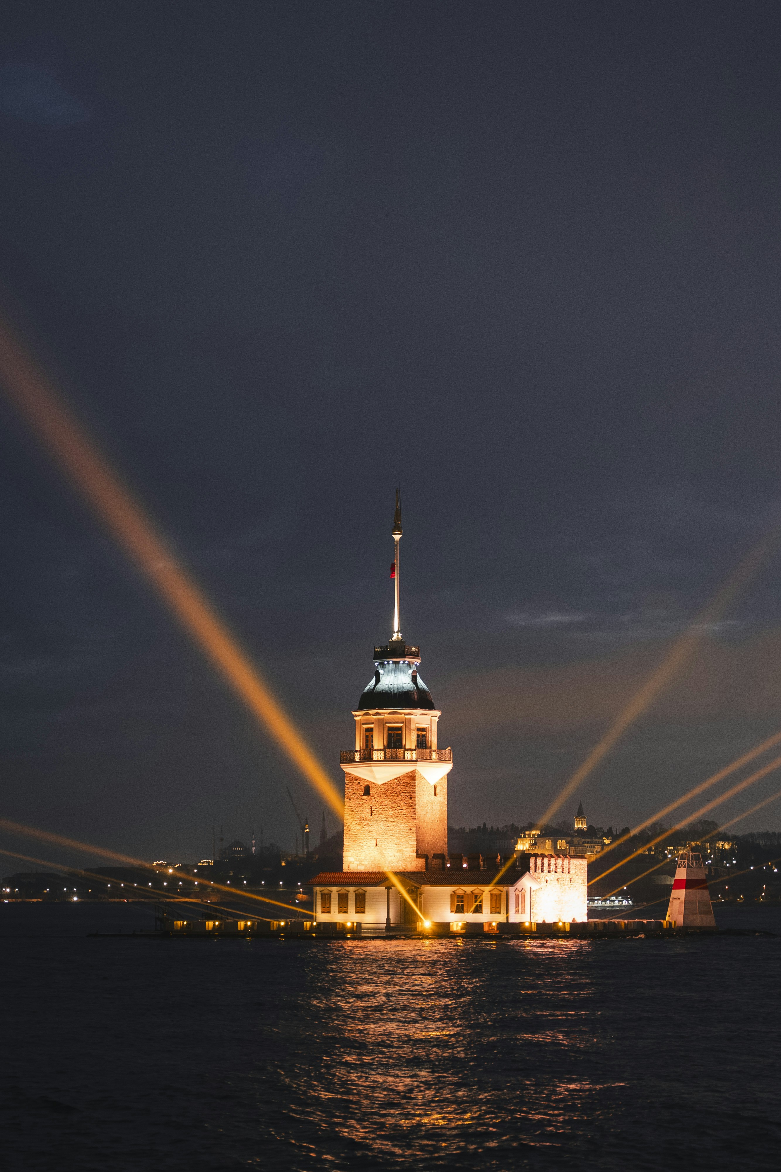 Beacon of Night: The Maiden's Tower Aglow in Beating Light Beams