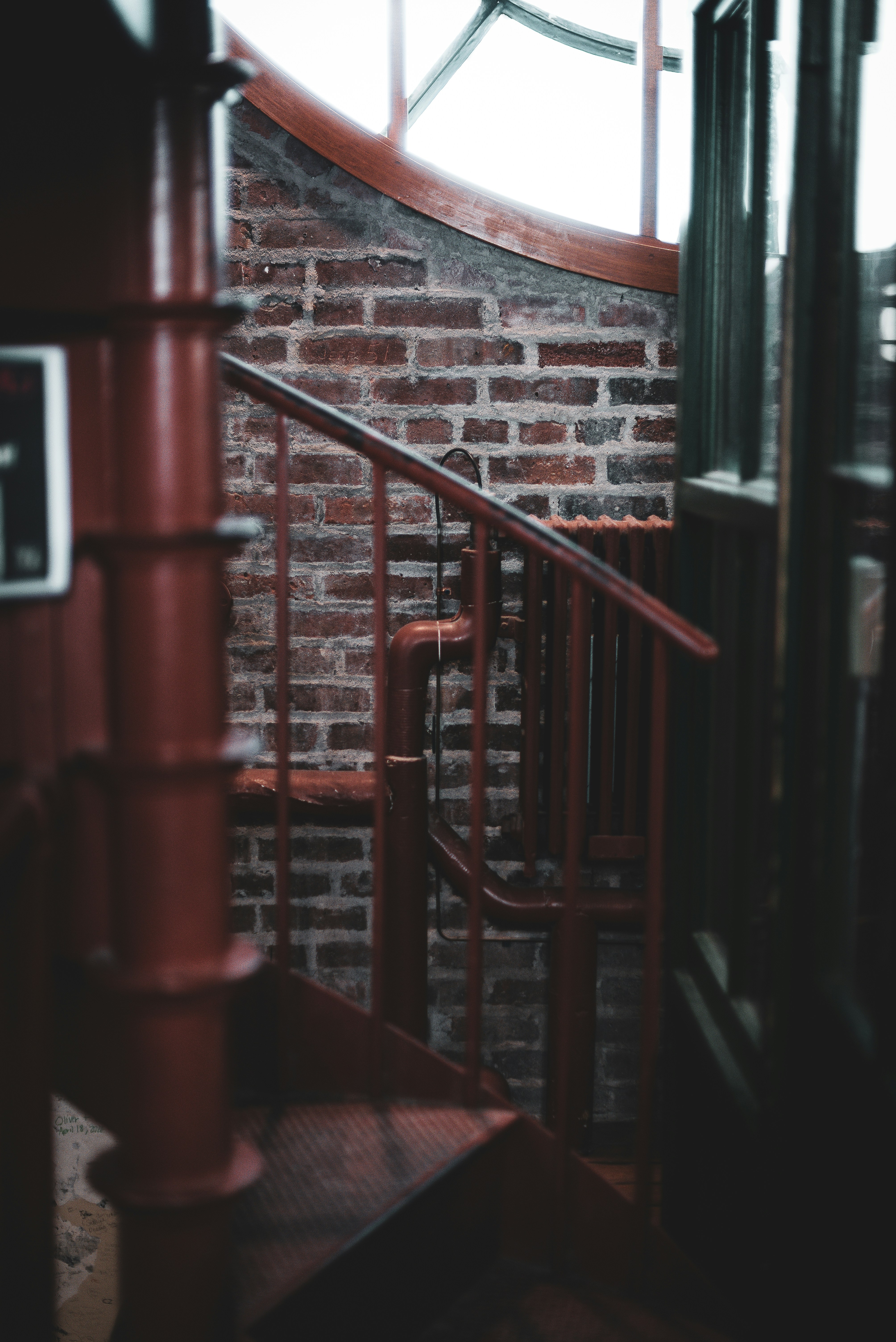 Brick Staircase Echoes: A Quiet Climb Through Iron and Light
