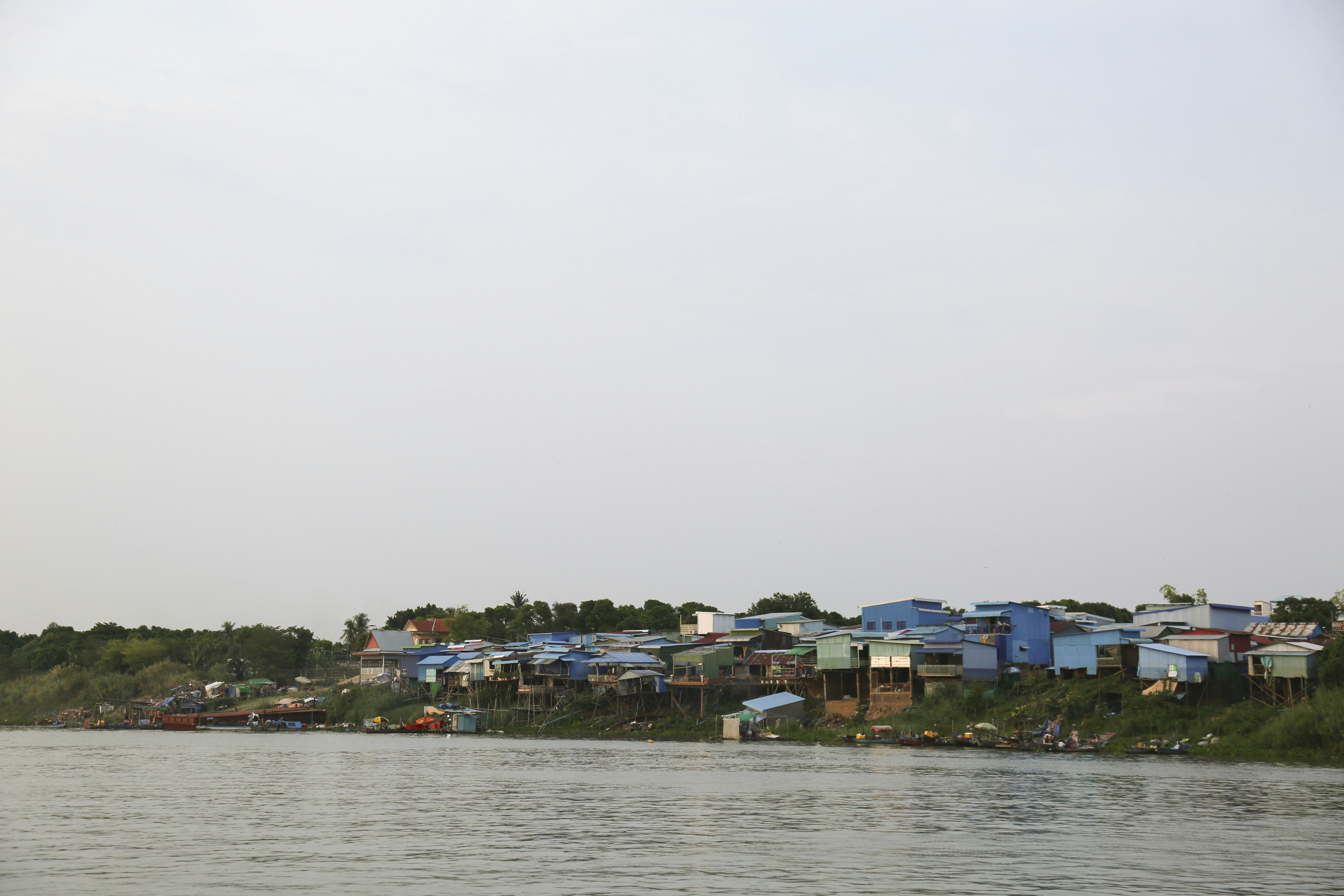 Riverside Stilt Houses Rippled by the Quiet Flow